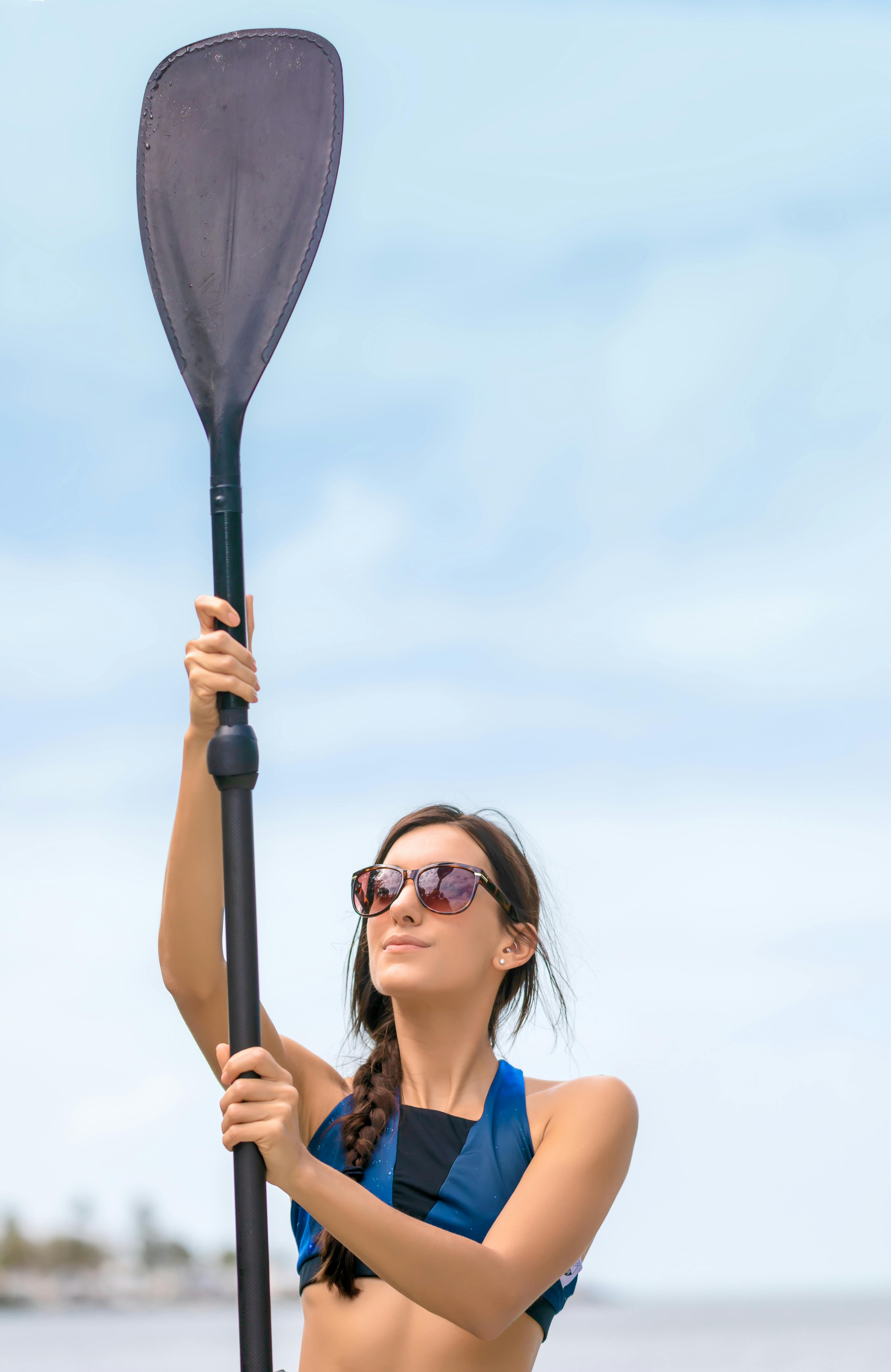 A Woman Holding a Paddle · Free Stock Photo