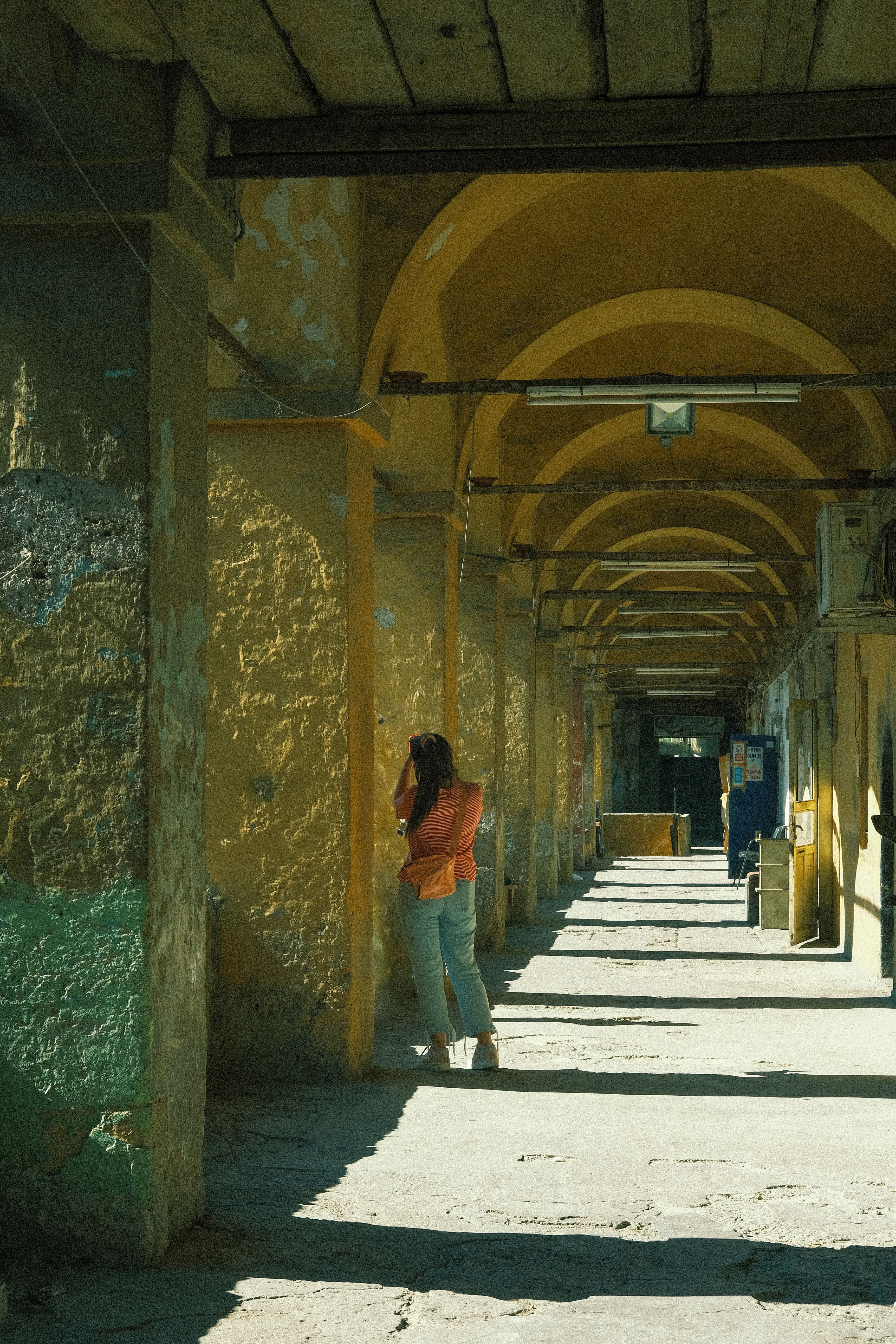Woman Standing in an Archway · Free Stock Photo