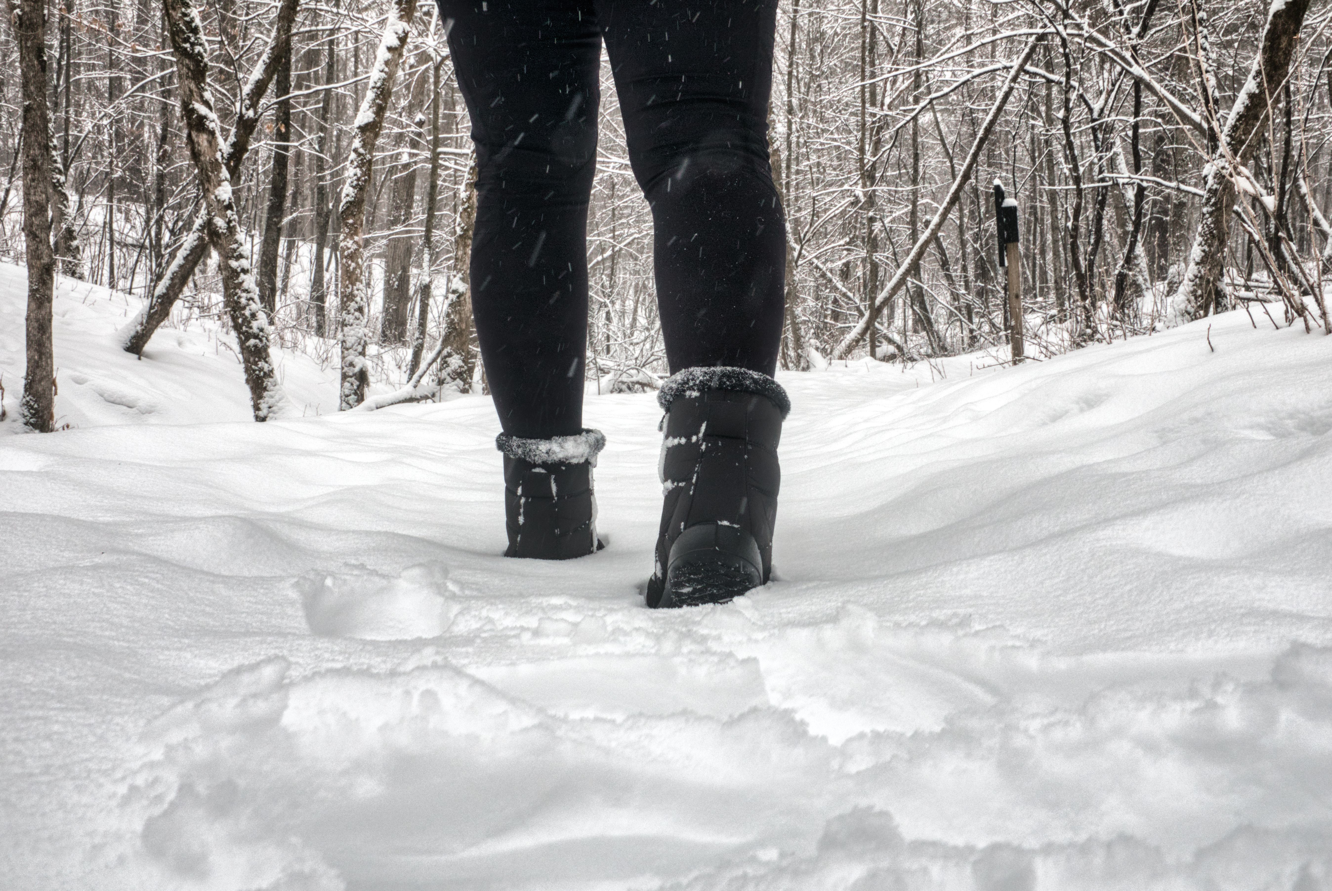 A Person Walking on Snow · Free Stock Photo