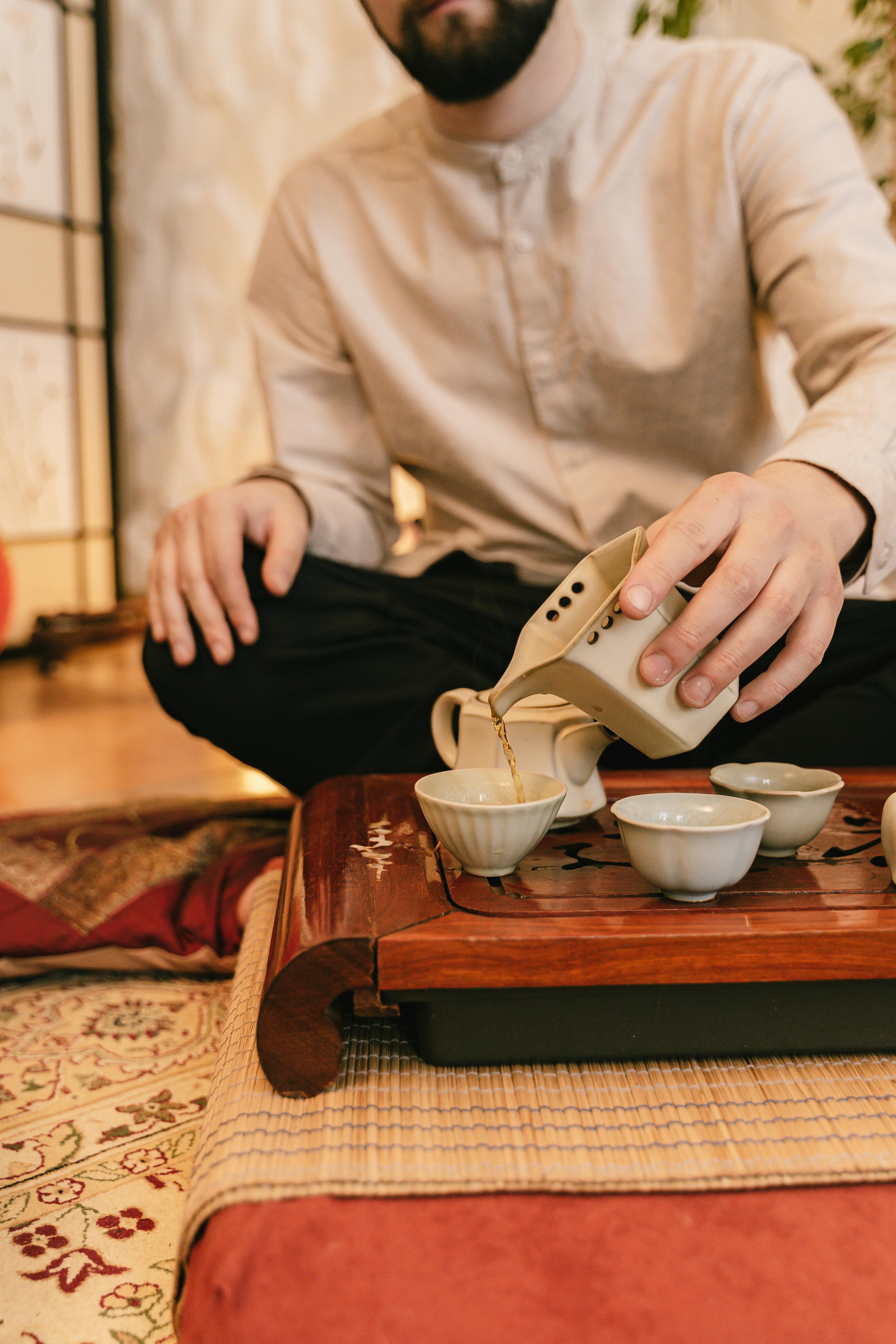 Person Pouring Tea · Free Stock Photo
