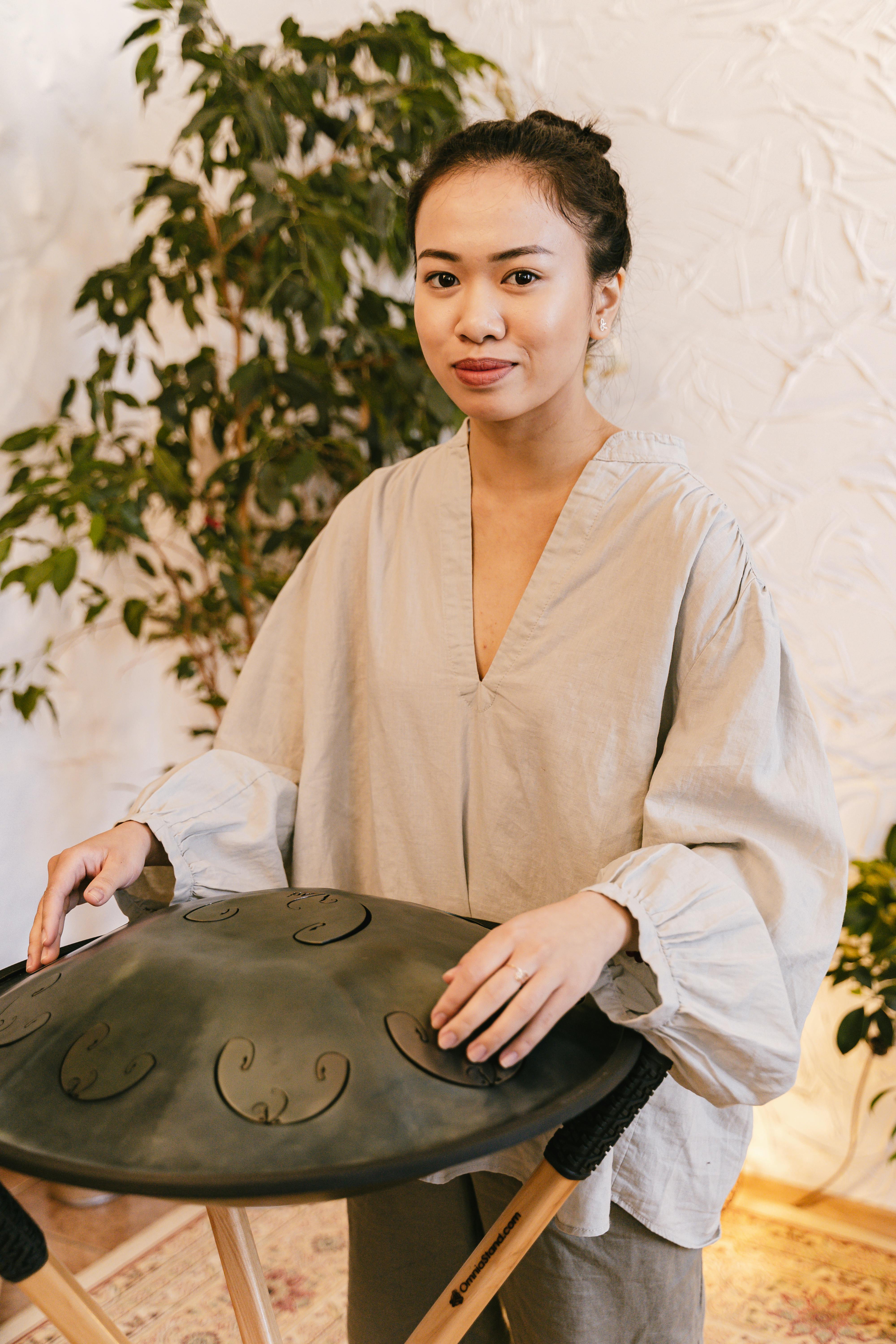 Close-Up Shot of a Person Using a Handpan · Free Stock Photo
