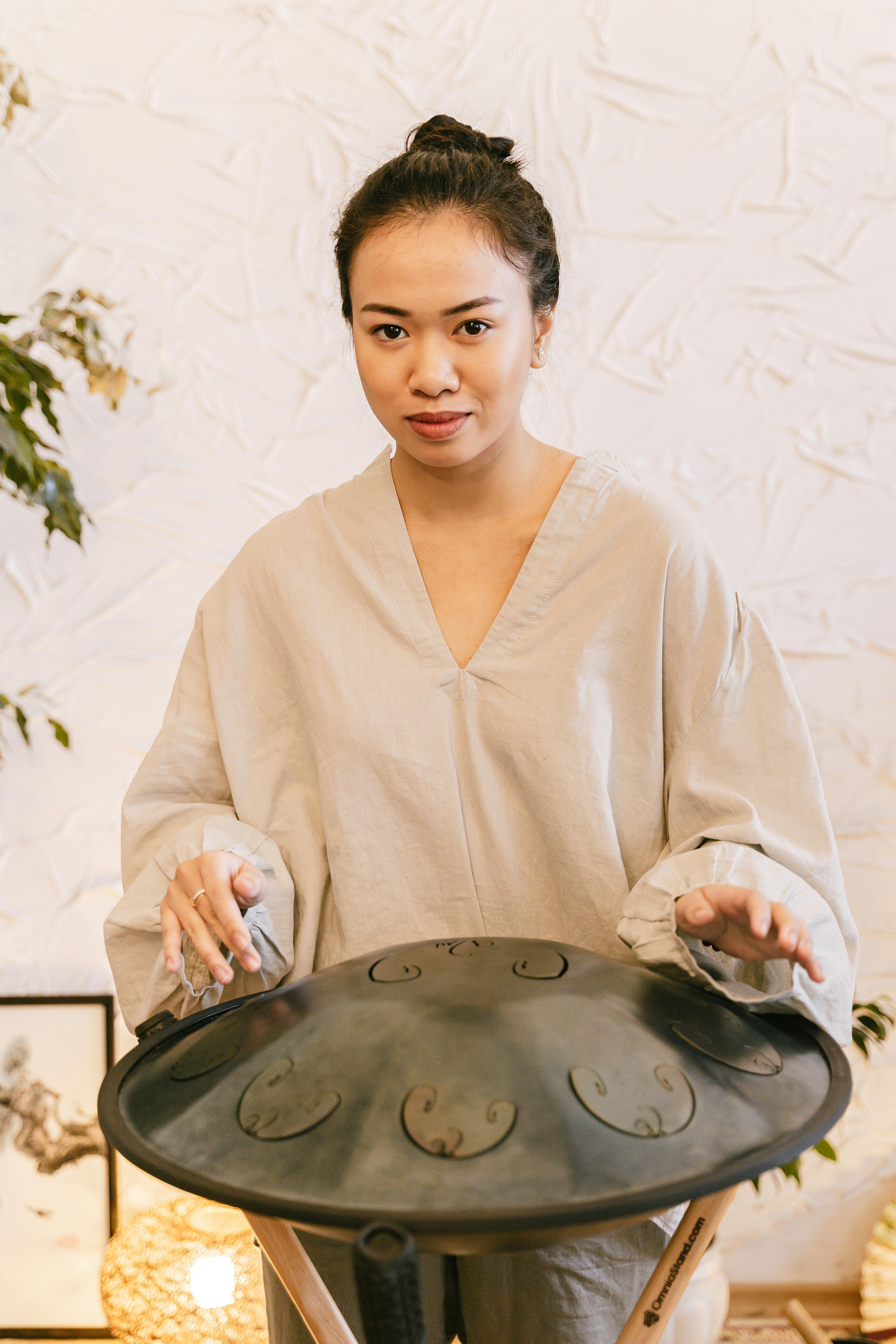 Woman Playing Percussion Instrument · Free Stock Photo