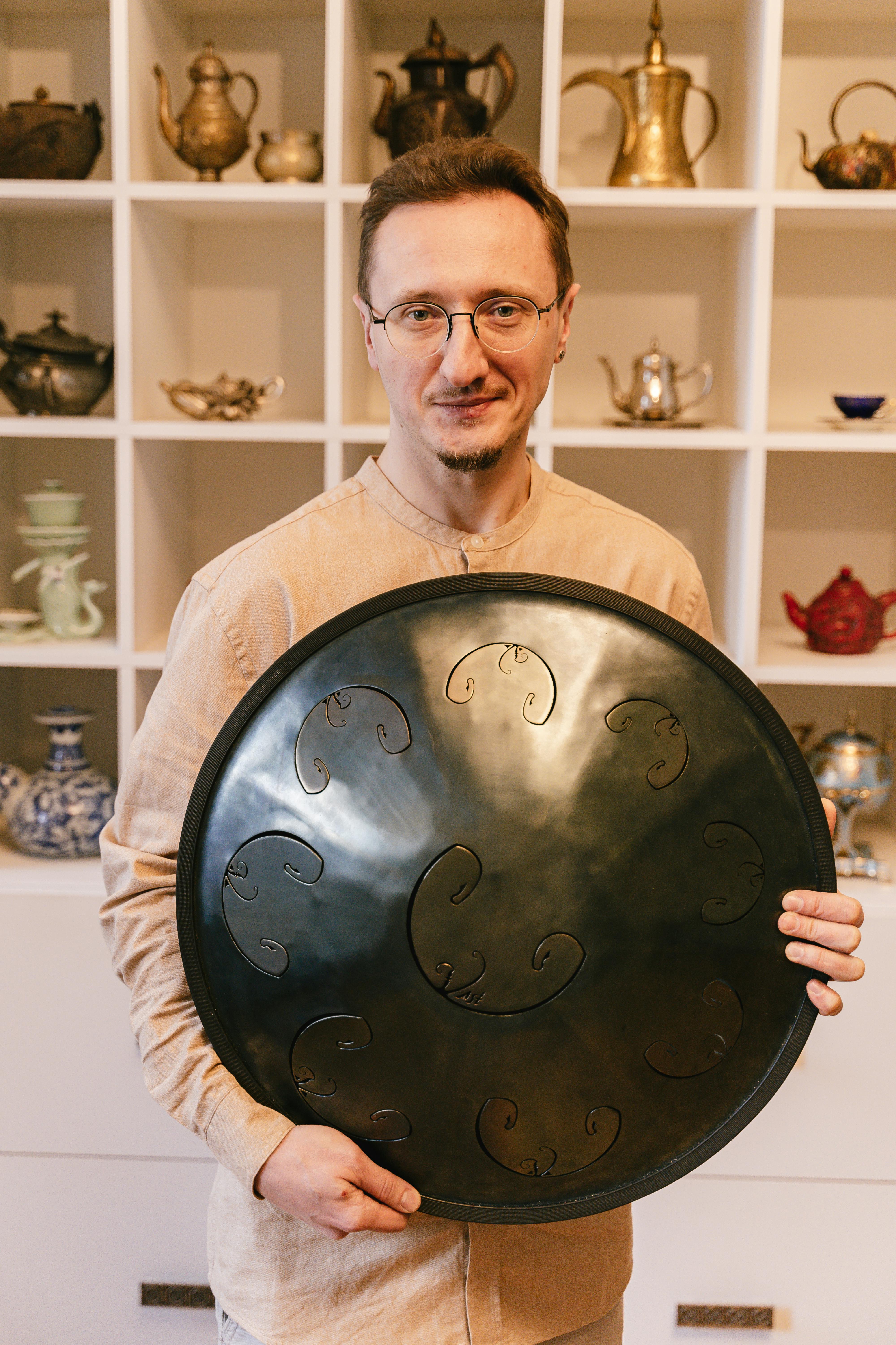 A Man Holding a Handpan · Free Stock Photo