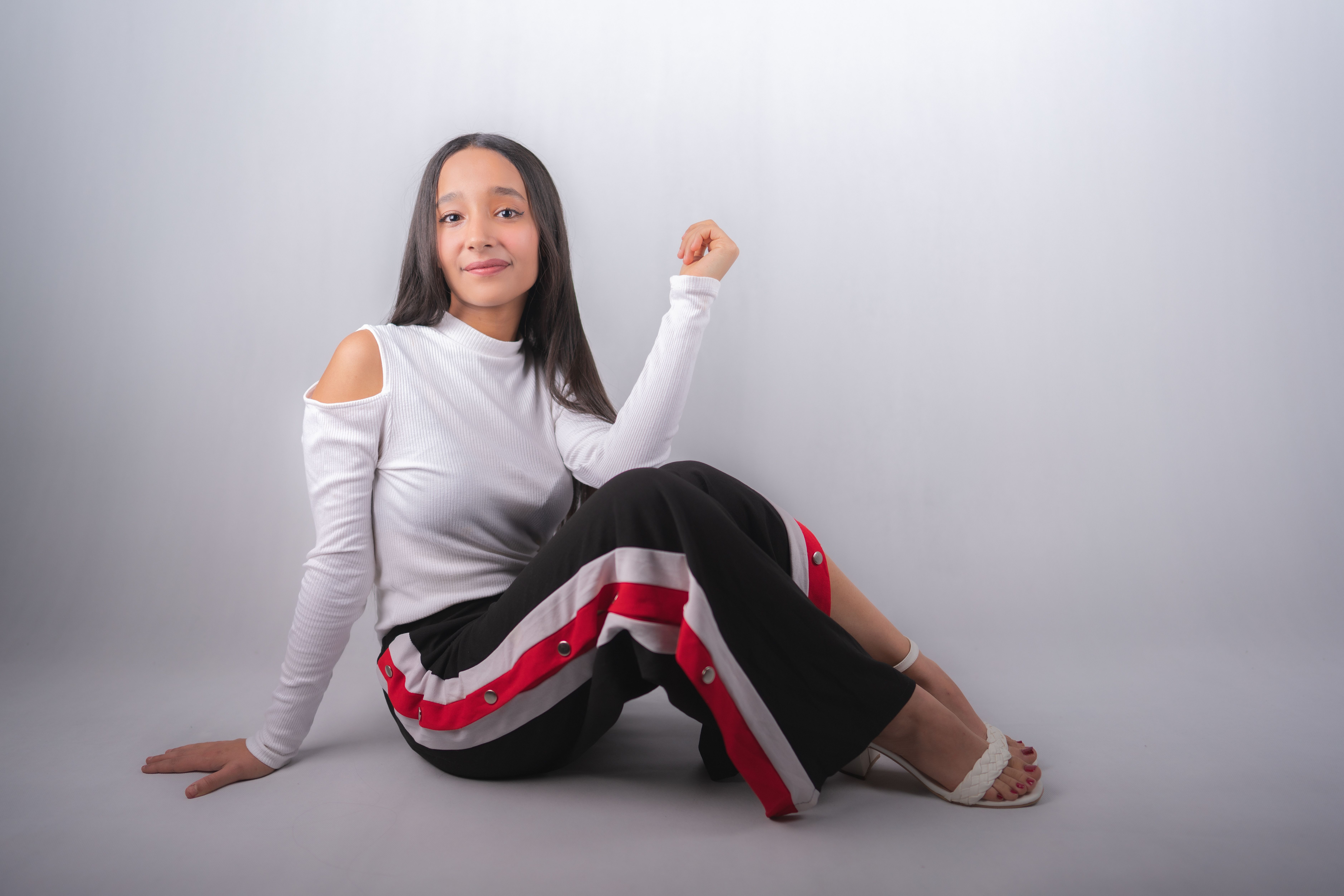 Girl sitting on a Concrete Surface · Free Stock Photo