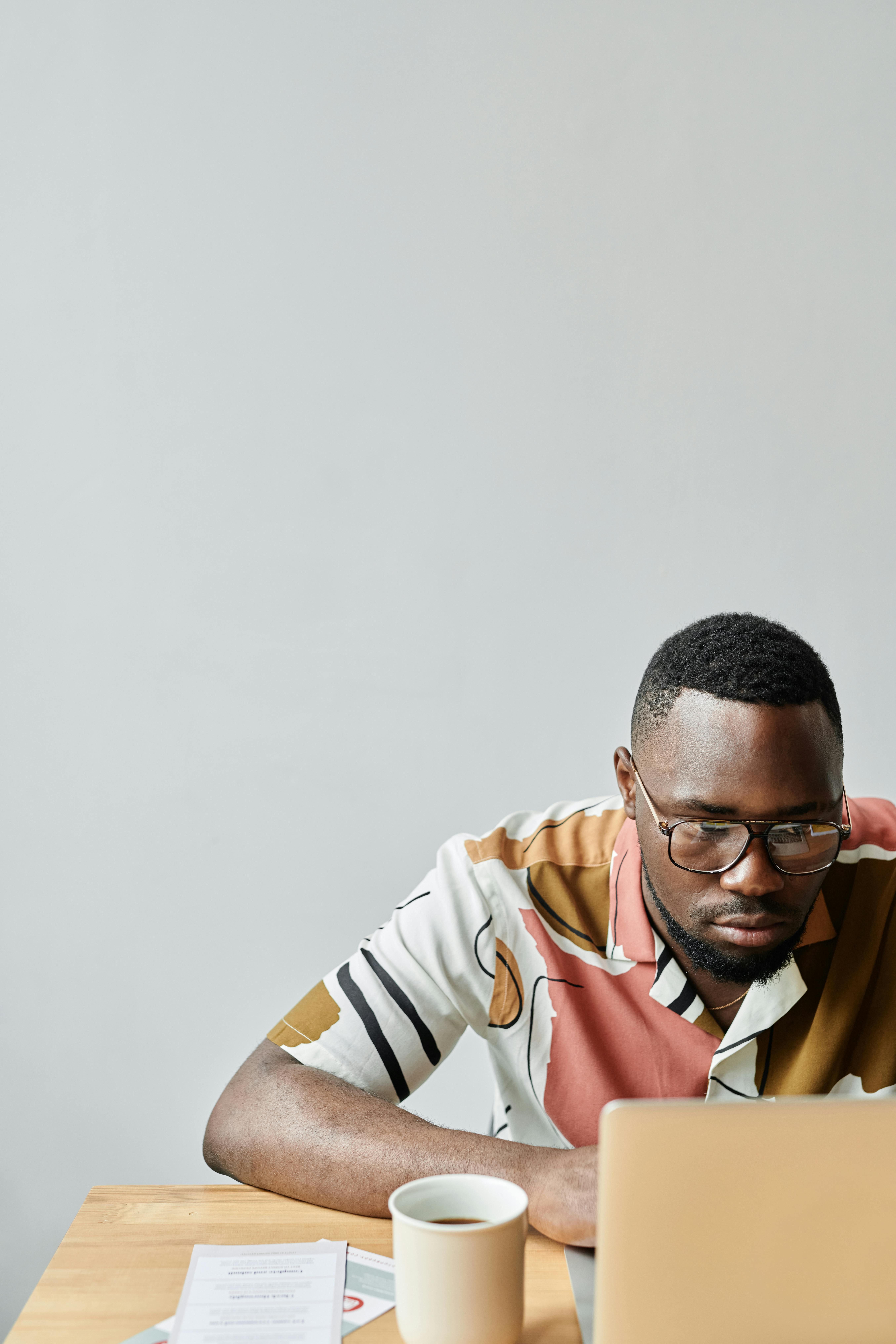 Man Sitting With a Laptop on his Lap · Free Stock Photo