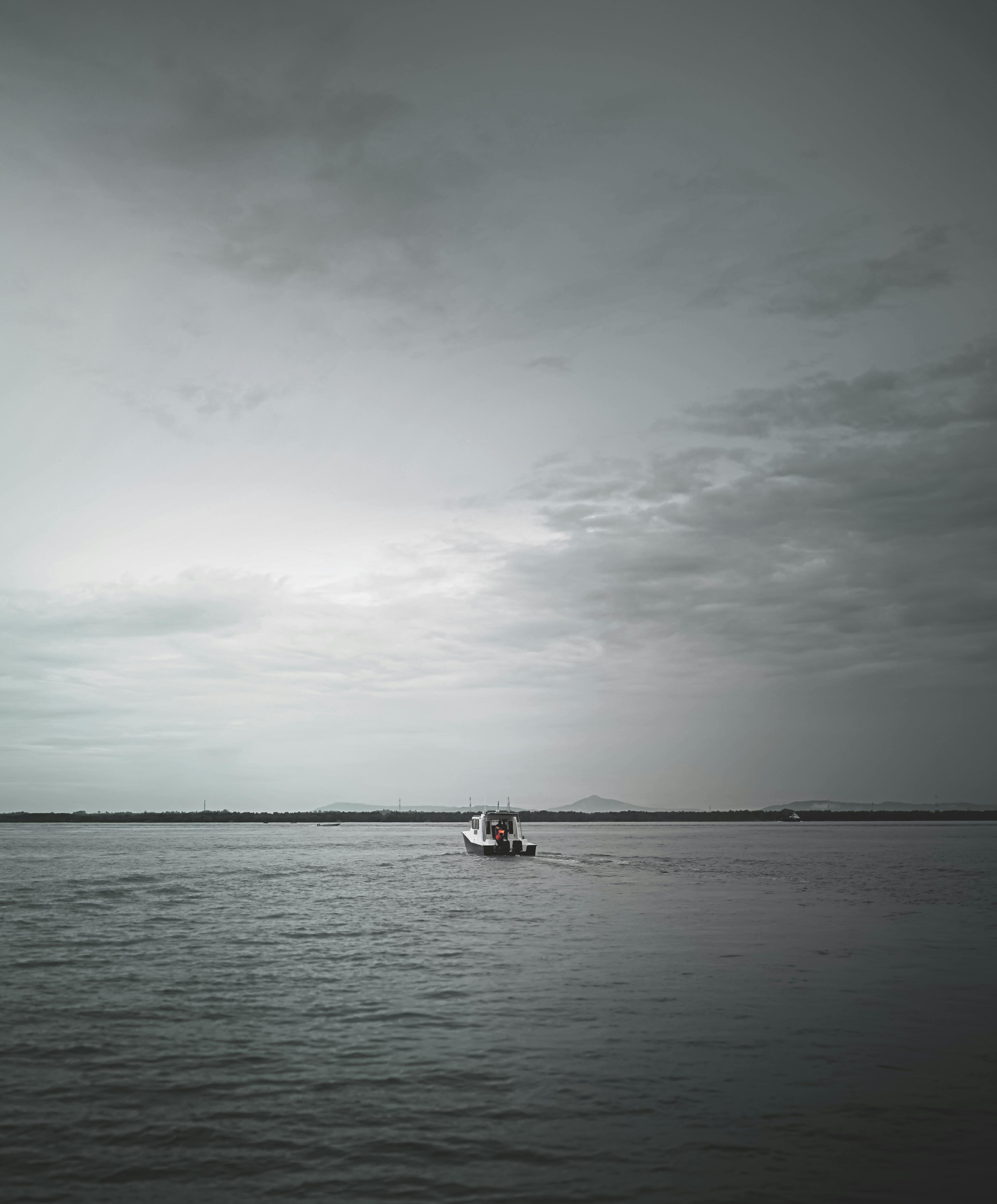 Grayscale Photograph of Boats on a Body of Water · Free Stock Photo