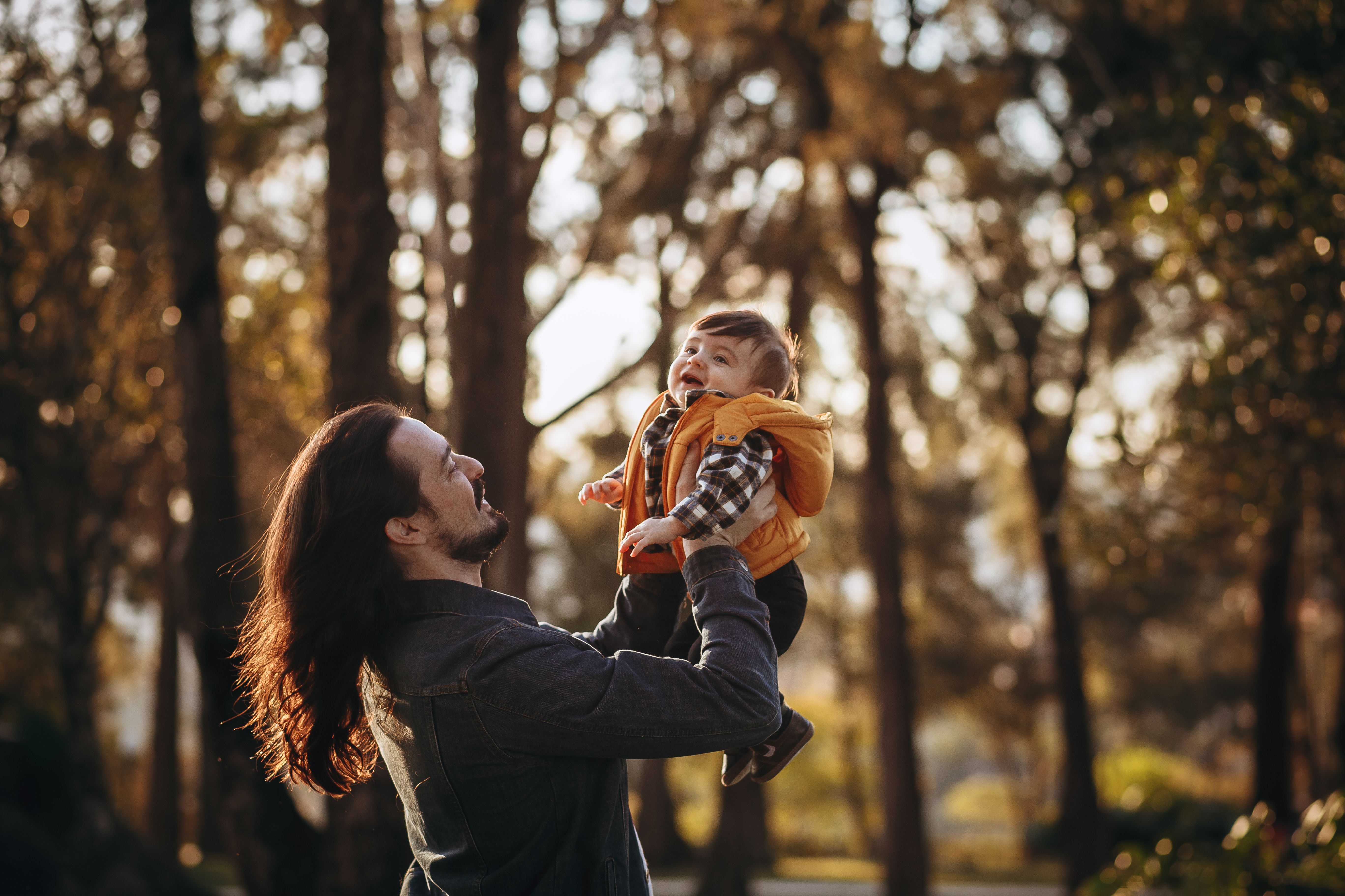 A Man Carrying a Boy on His Shoulder · Free Stock Photo