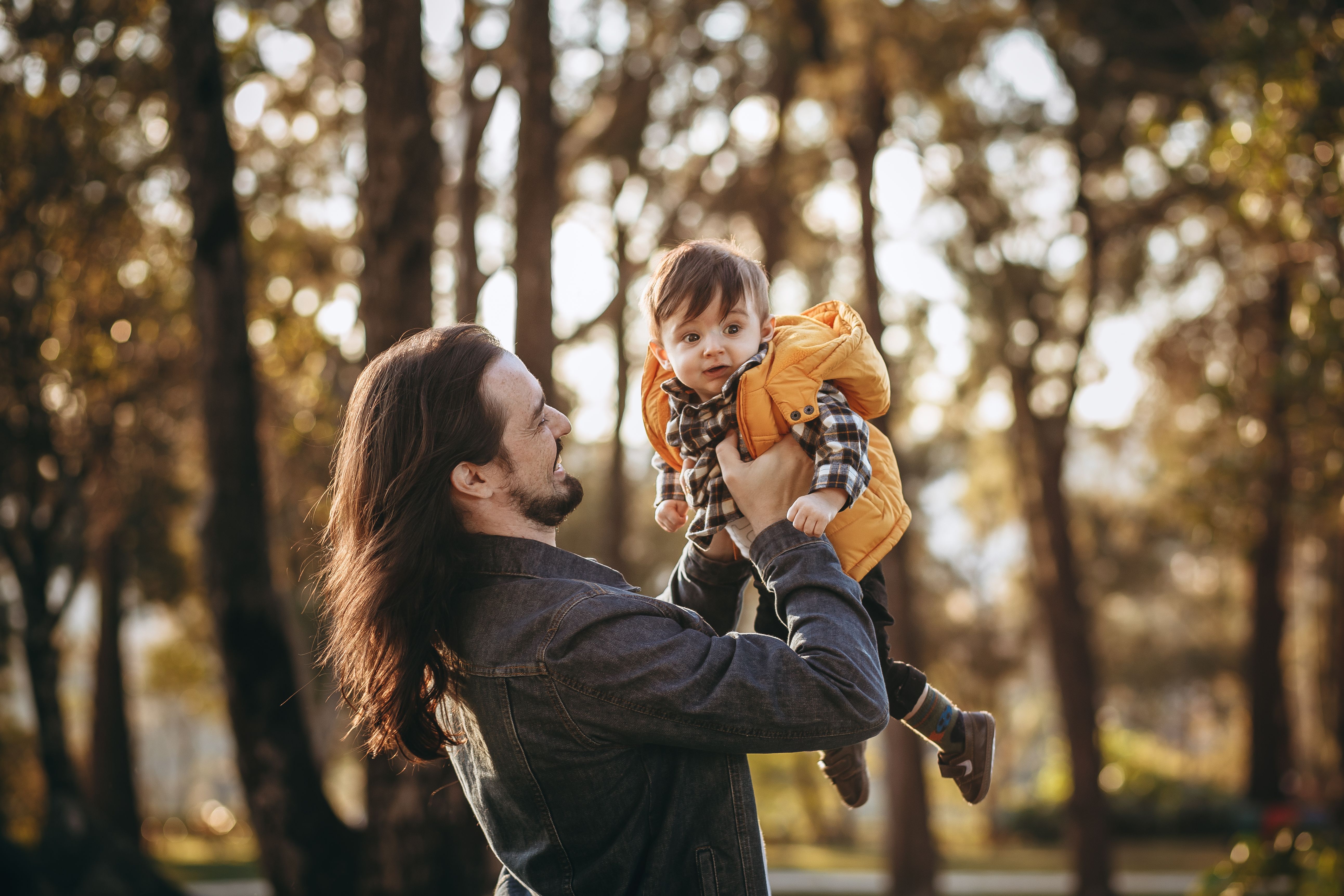 A Man Carrying a Boy on His Shoulder · Free Stock Photo