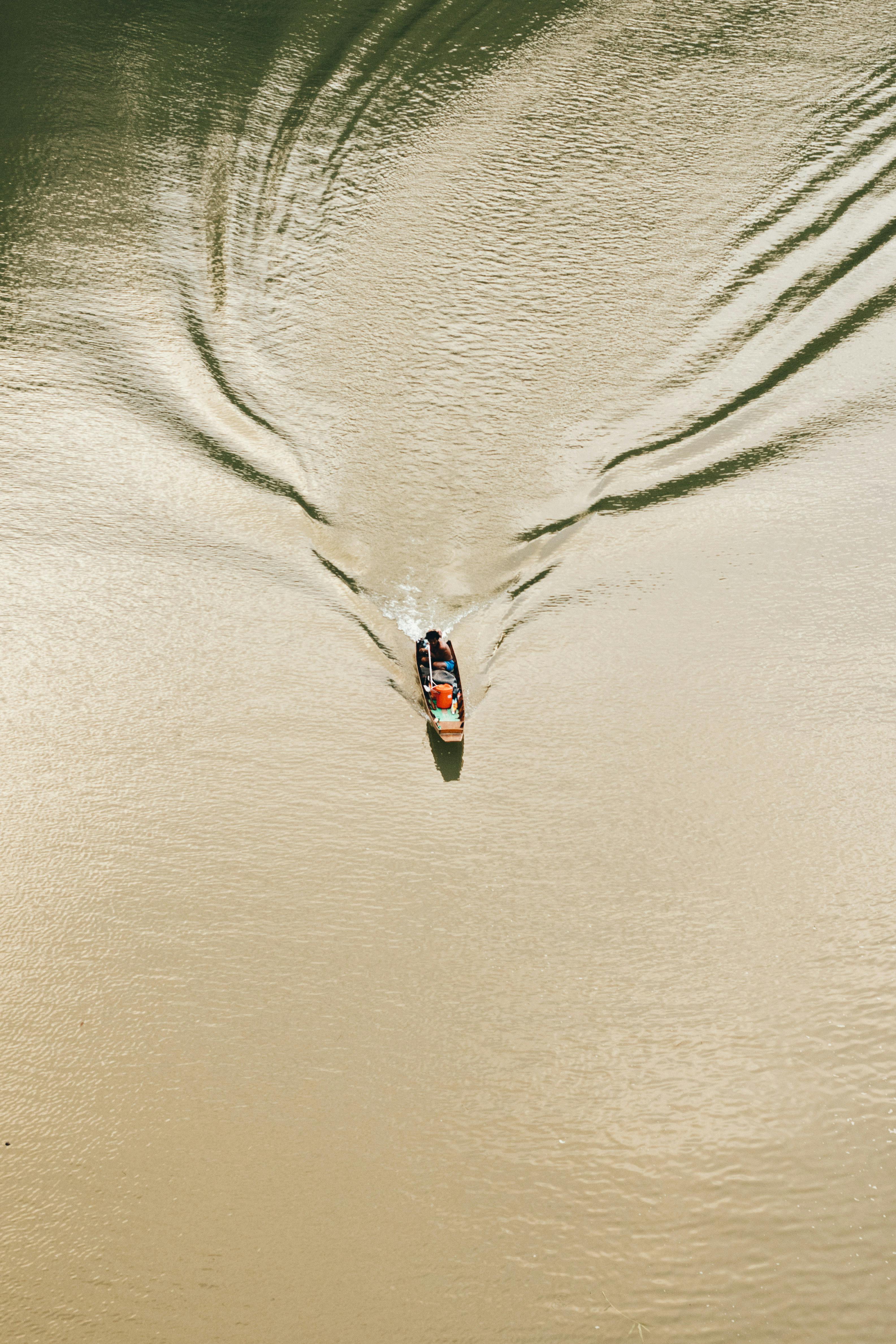 Aerial View of a Boat Sailing on the Sea · Free Stock Photo