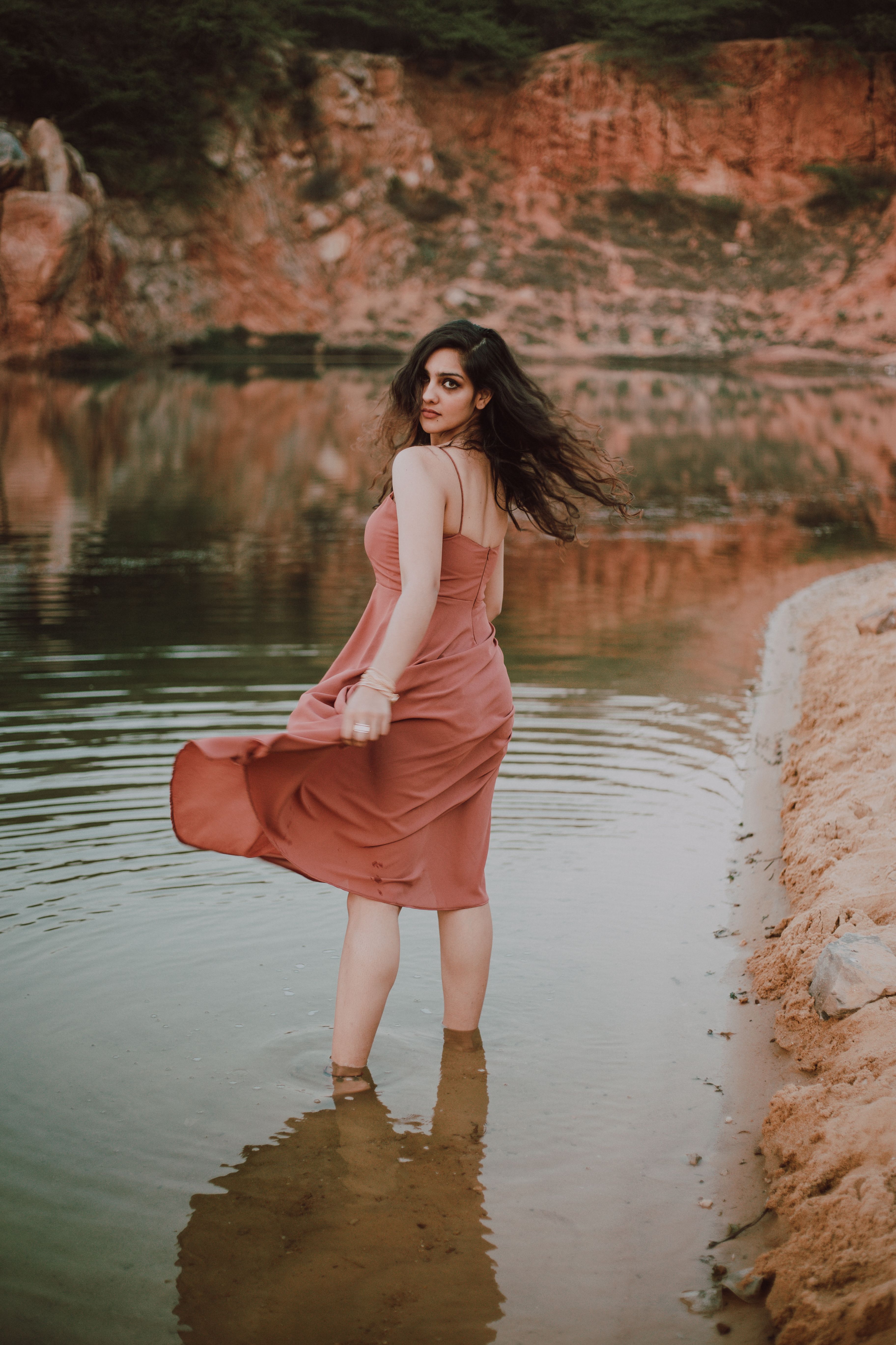 Stylish woman in summer dress standing in water of lake · Free Stock Photo