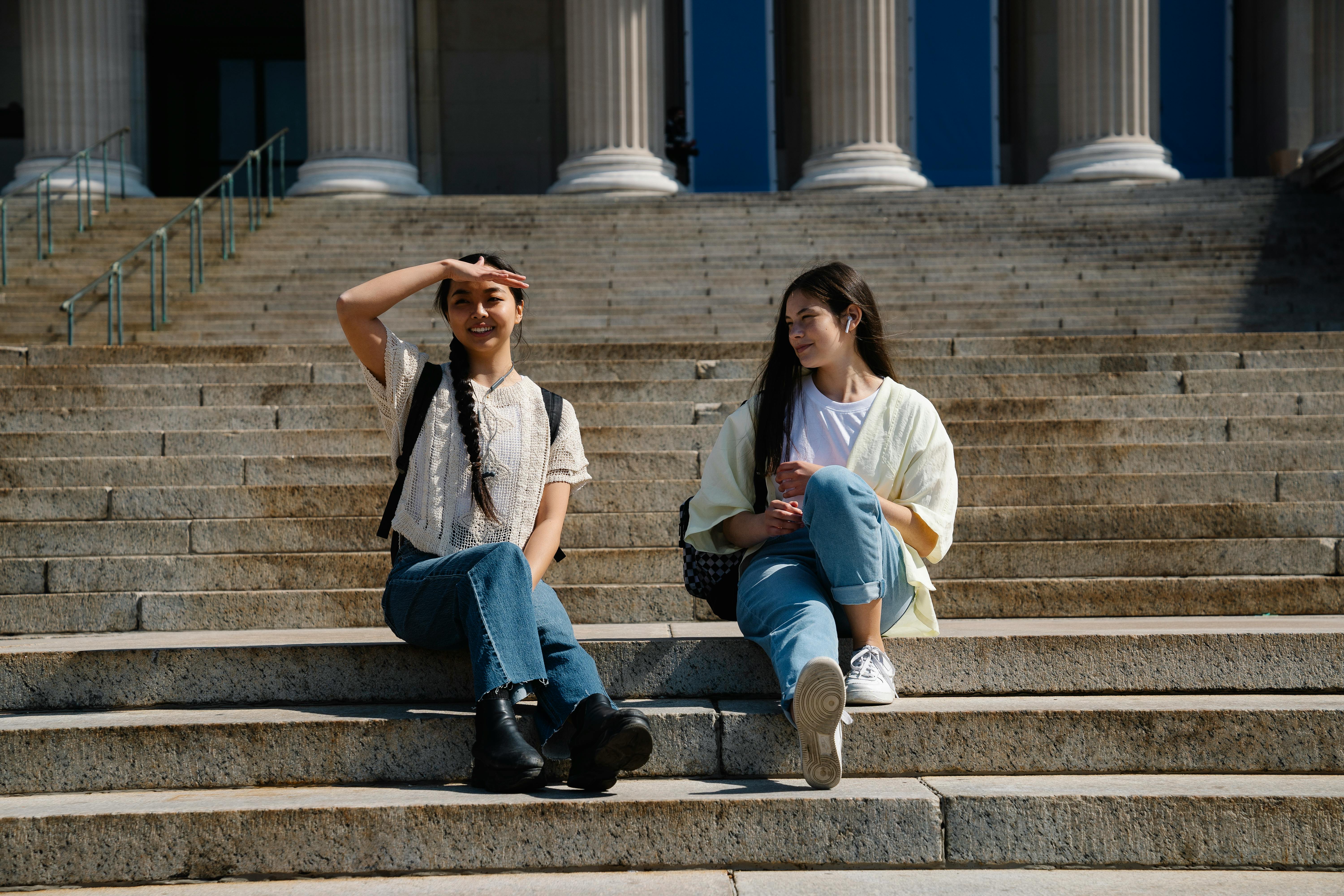 Women Sitting on Stairs · Free Stock Photo