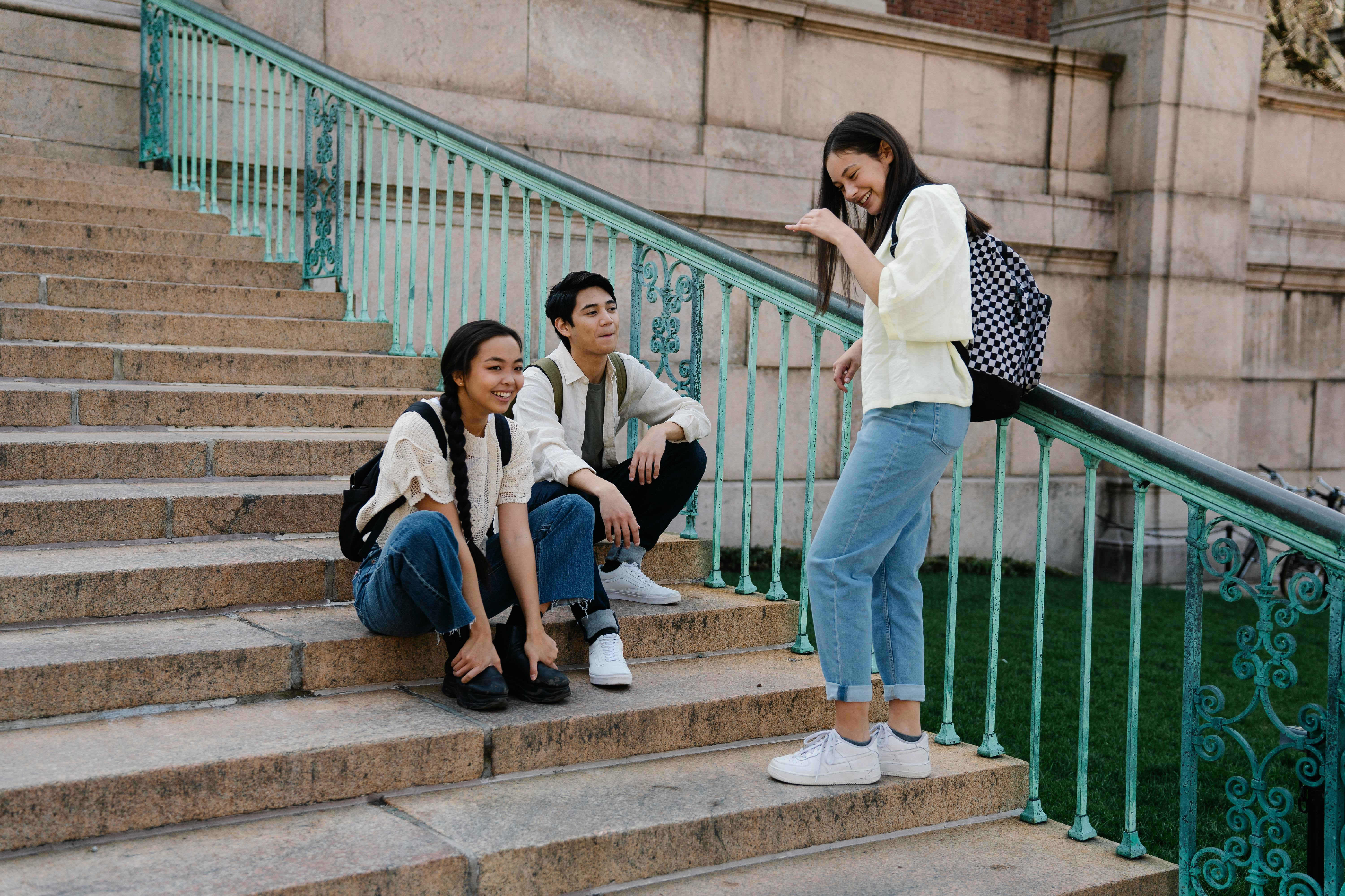 Friends Resting on the Stairs · Free Stock Photo