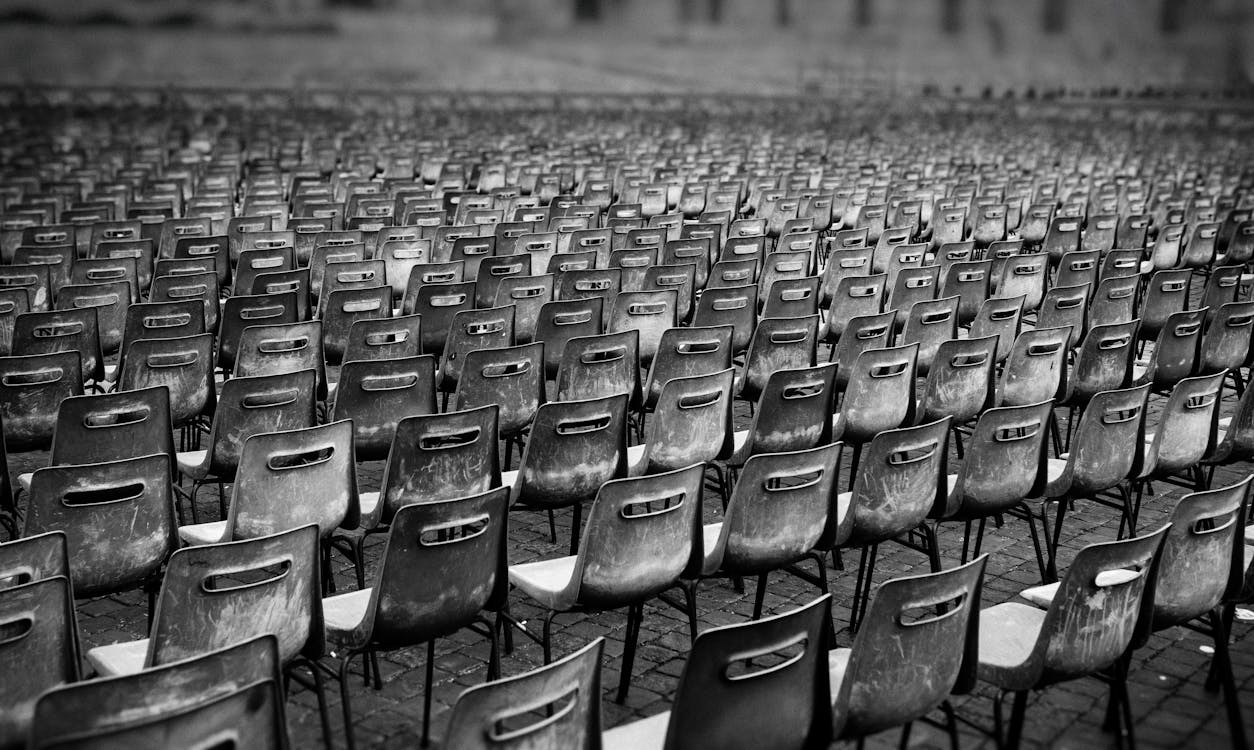 Grayscale Photo of Chairs in the Stadium · Free Stock Photo Grayscale Photo of Chairs in the Stadium · Free Stock Photo