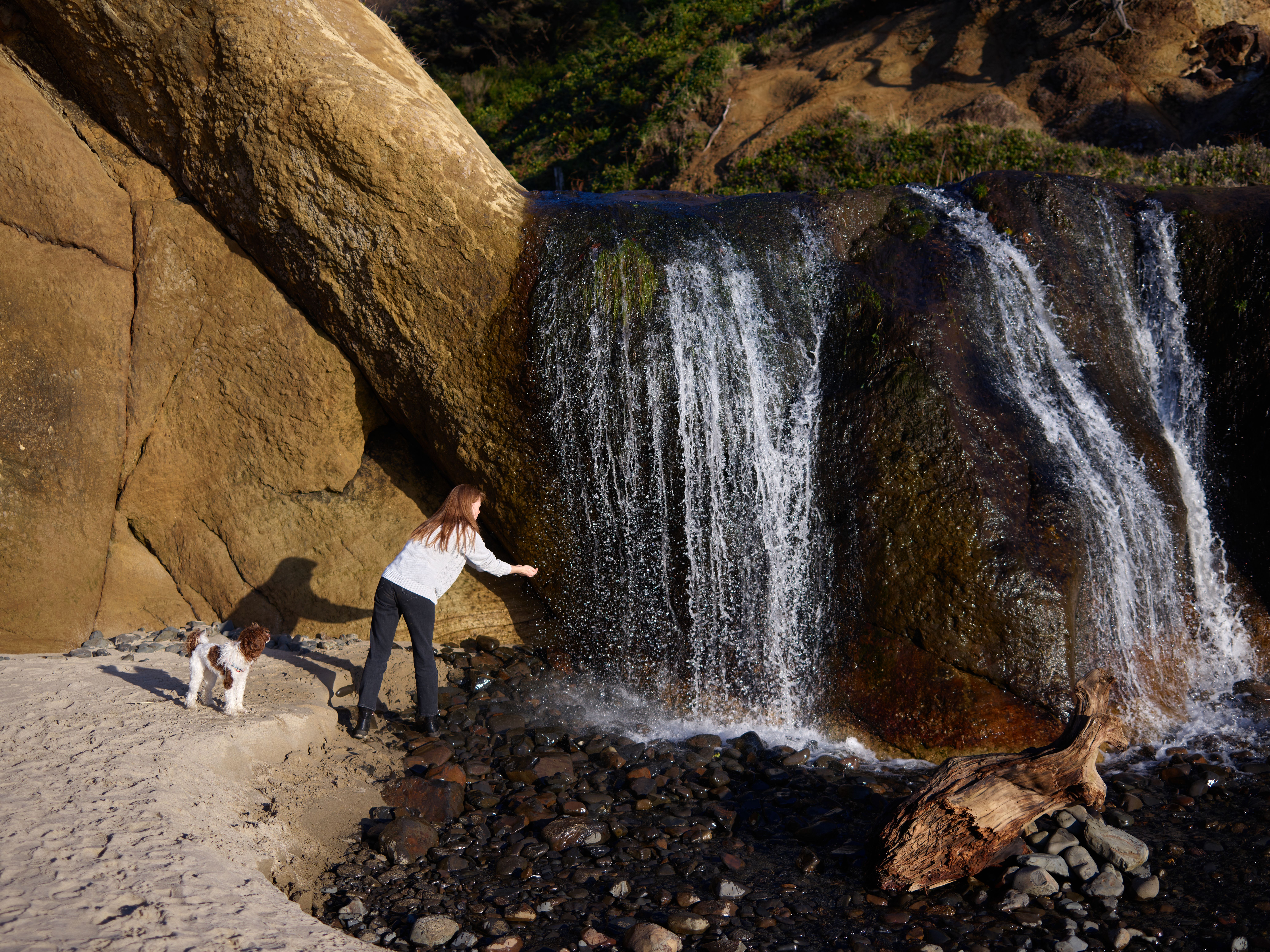 A Man Washing Her Hands on the Waterfall · Free Stock Photo