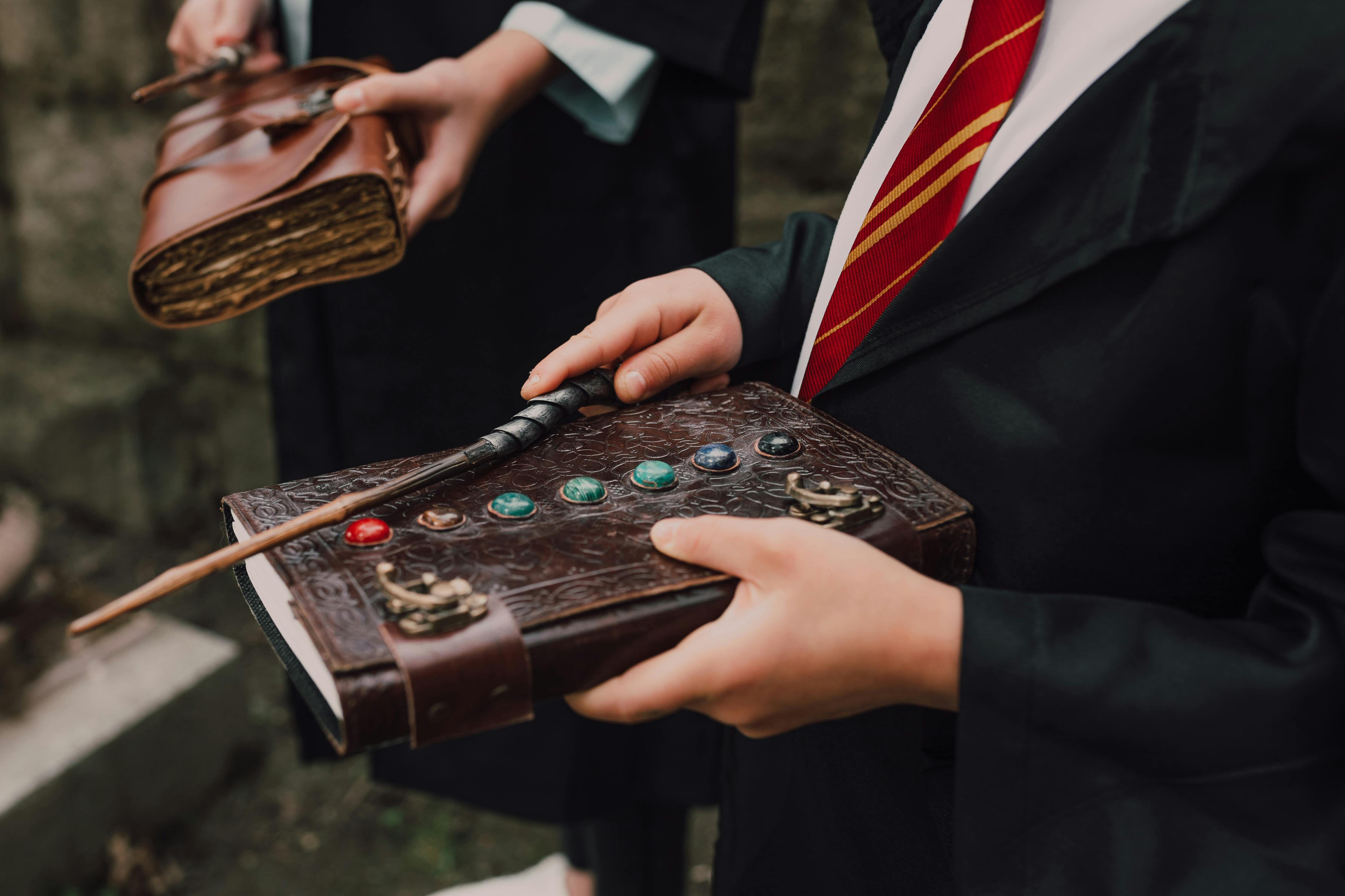 People Holding Wands and Books · Free Stock Photo