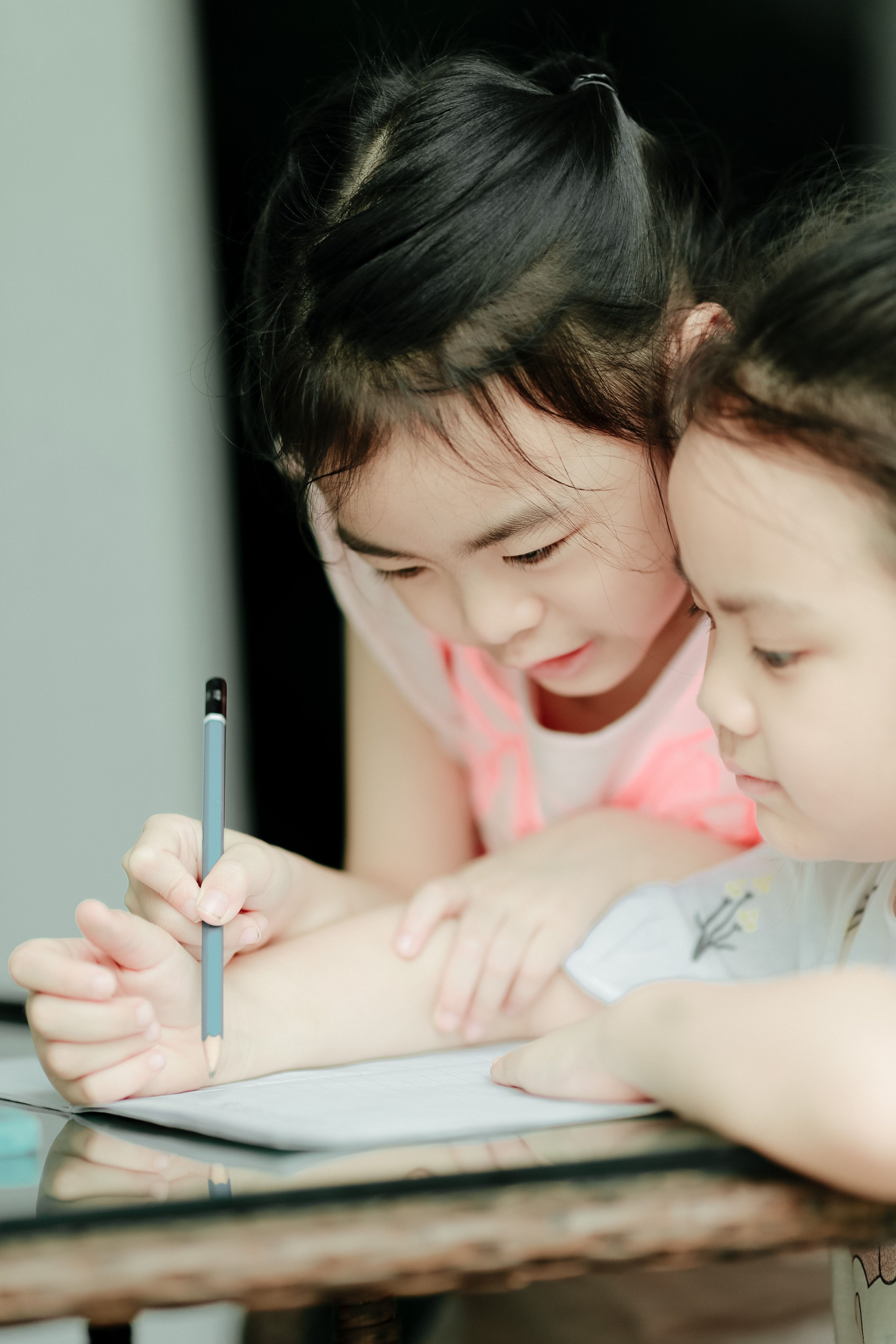 Girl Writing on the Notebook · Free Stock Photo