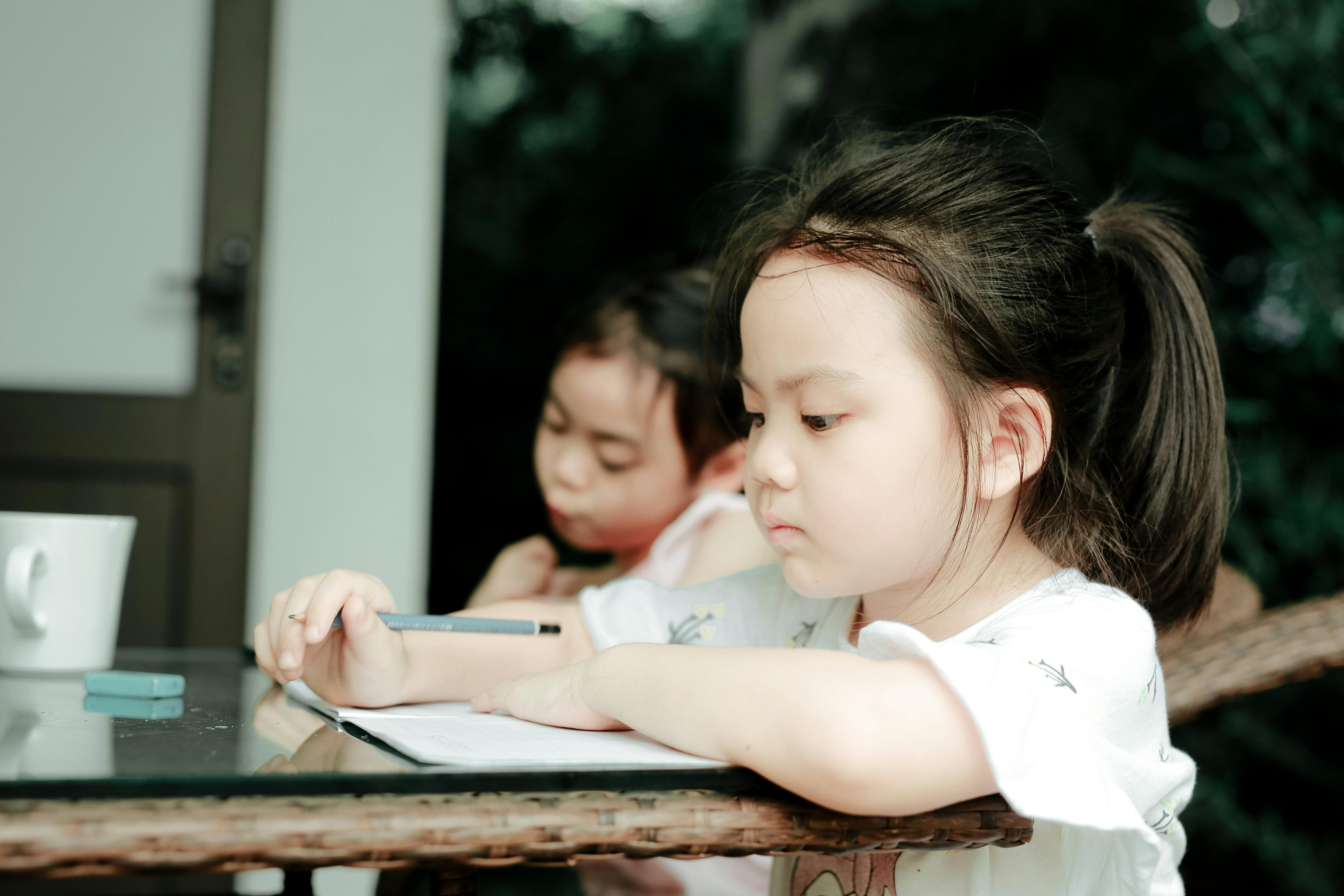 Two Boys Writing · Free Stock Photo