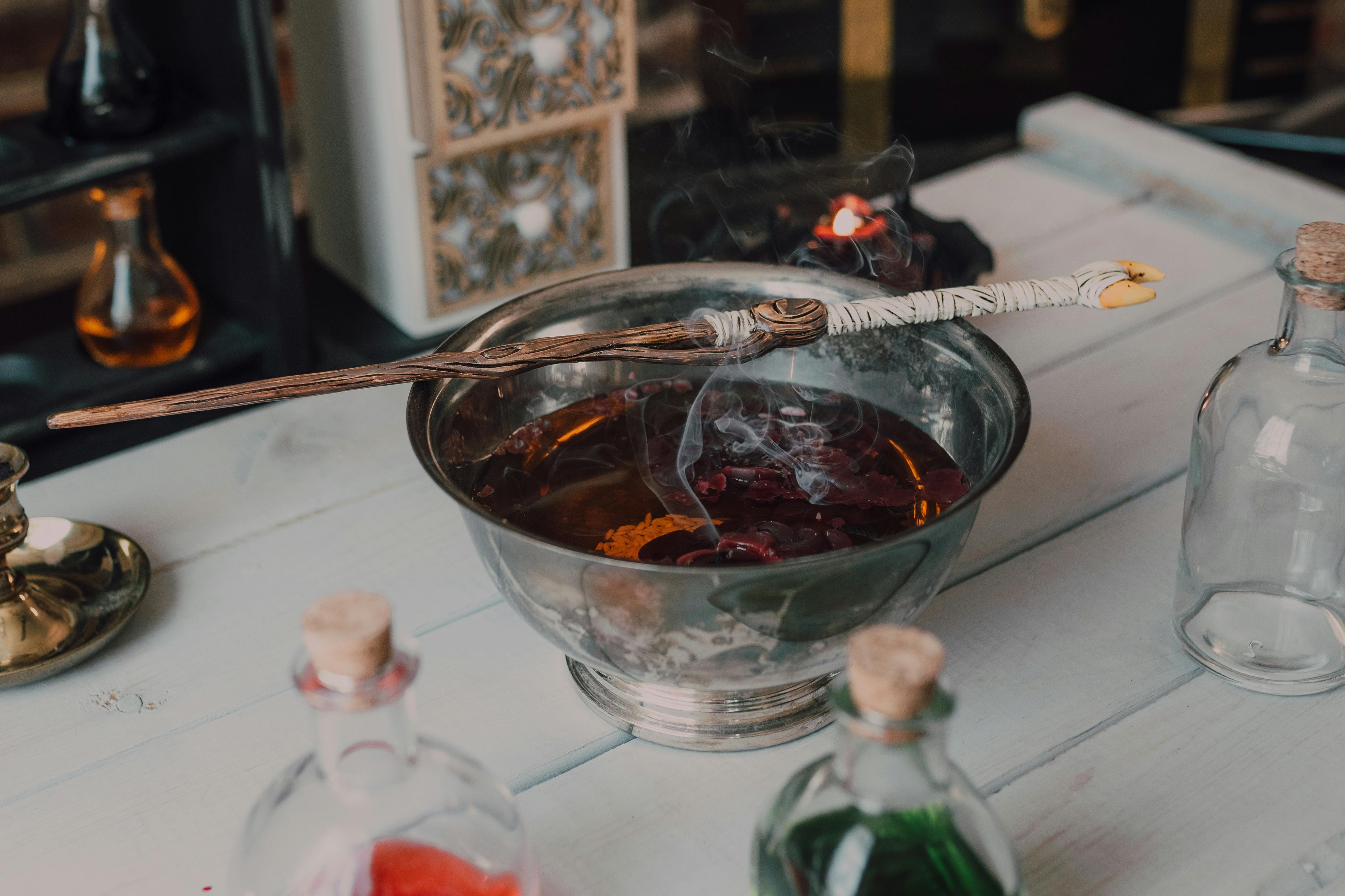 Vape and Vaporette Liquid Container on a Wooden Table · Free Stock Photo