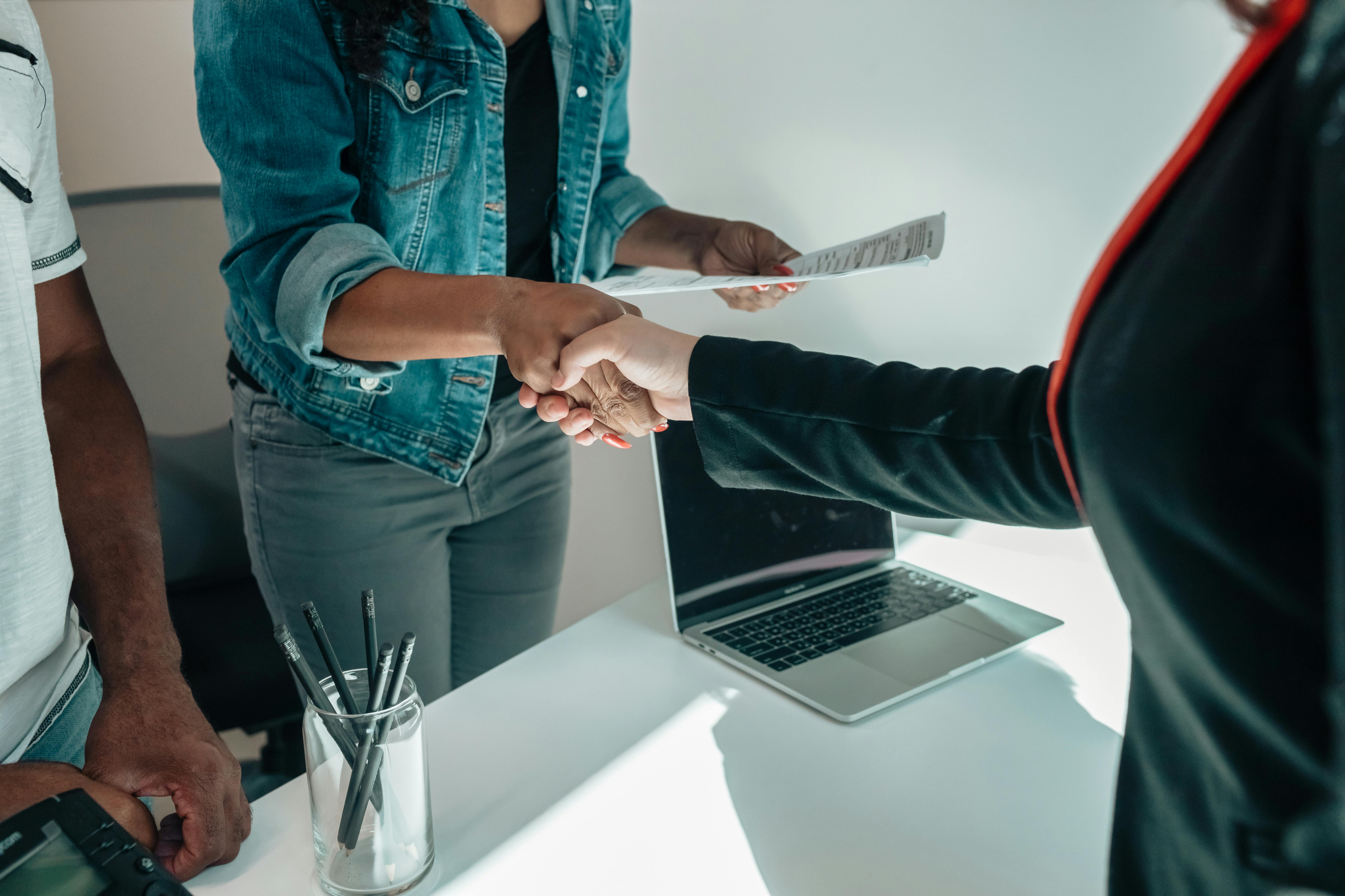Two People Shaking Hands · Free Stock Photo