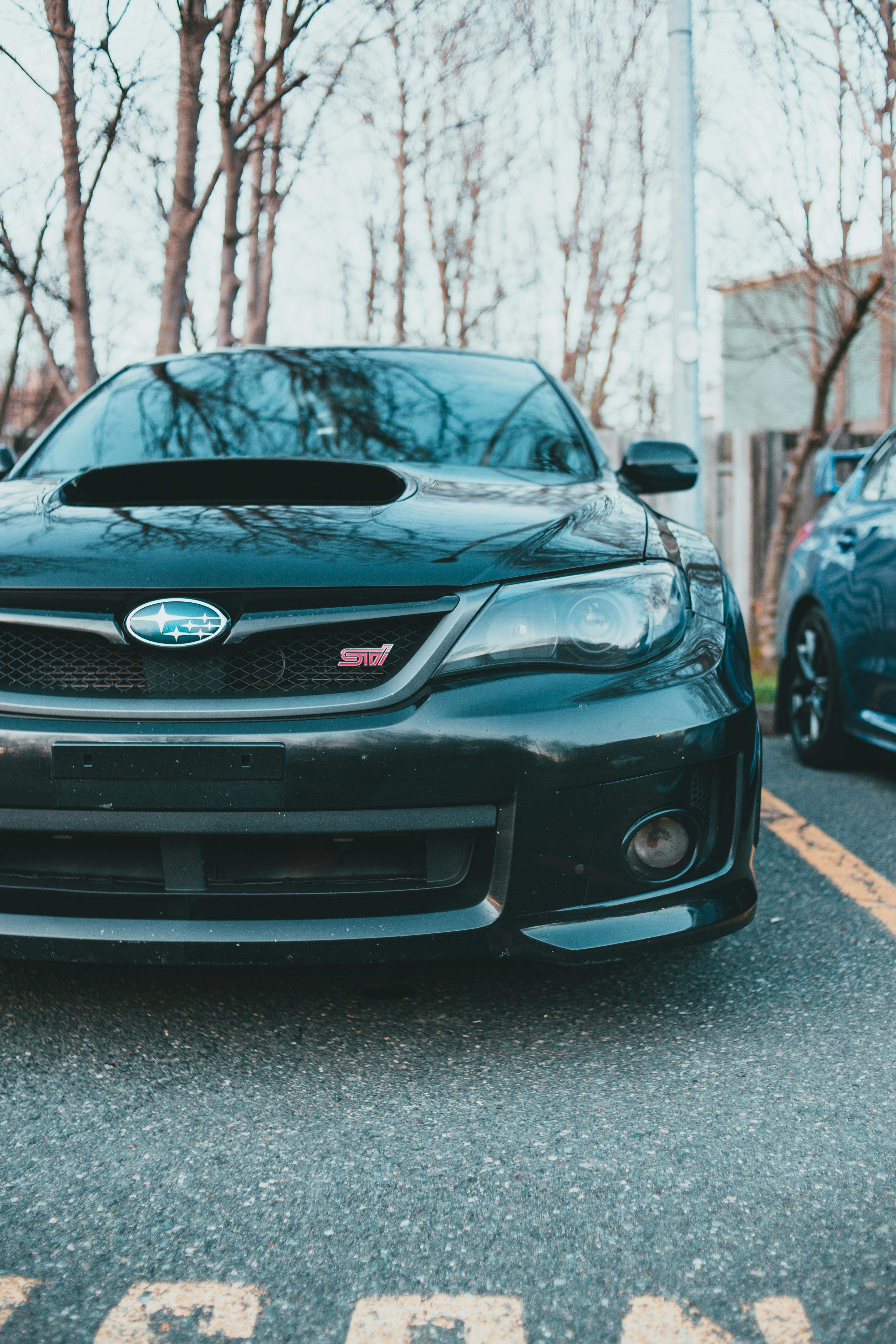 A Shiny Black Car on the Road · Free Stock Photo