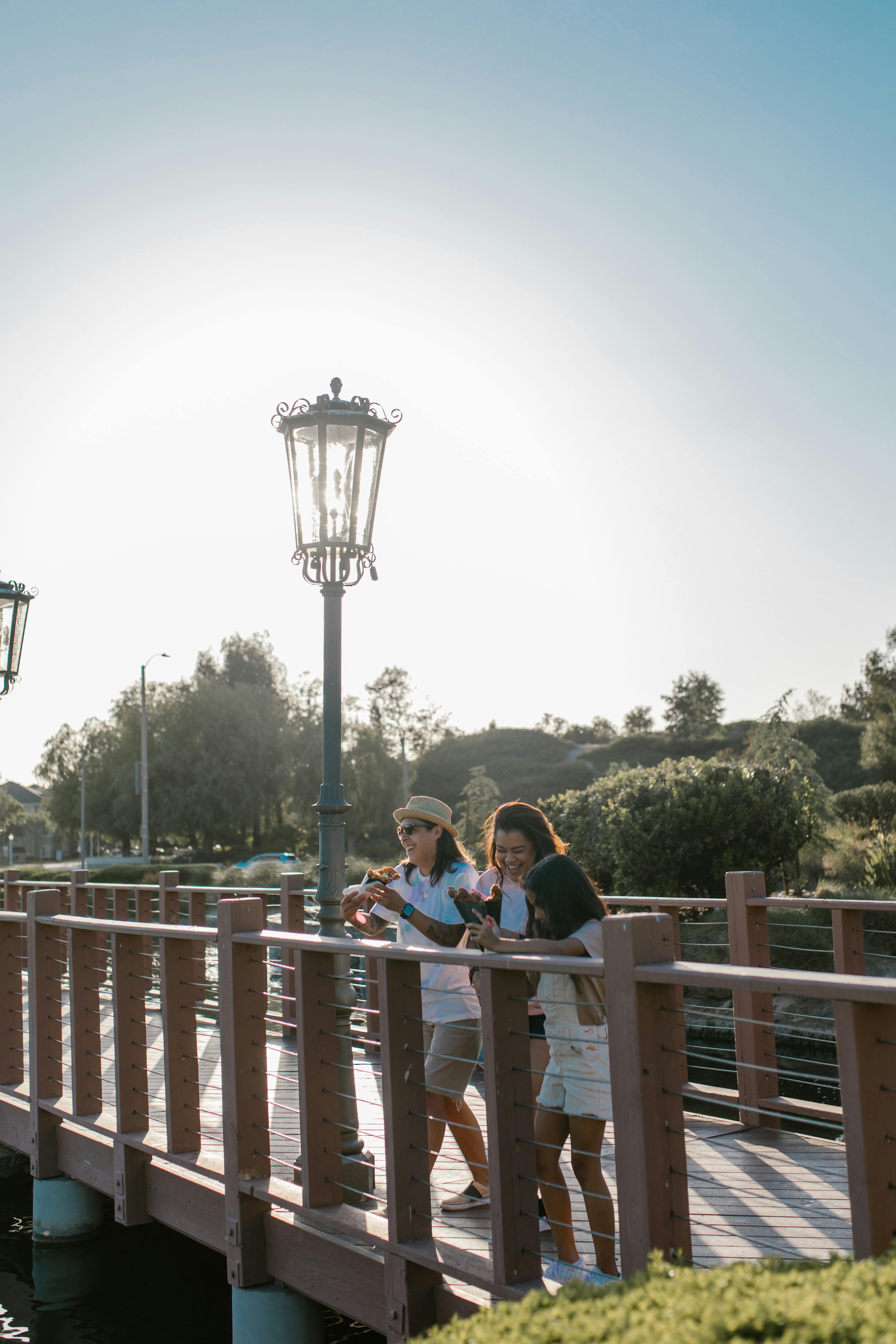 A Family Standing in the Foot Bridge · Free Stock Photo