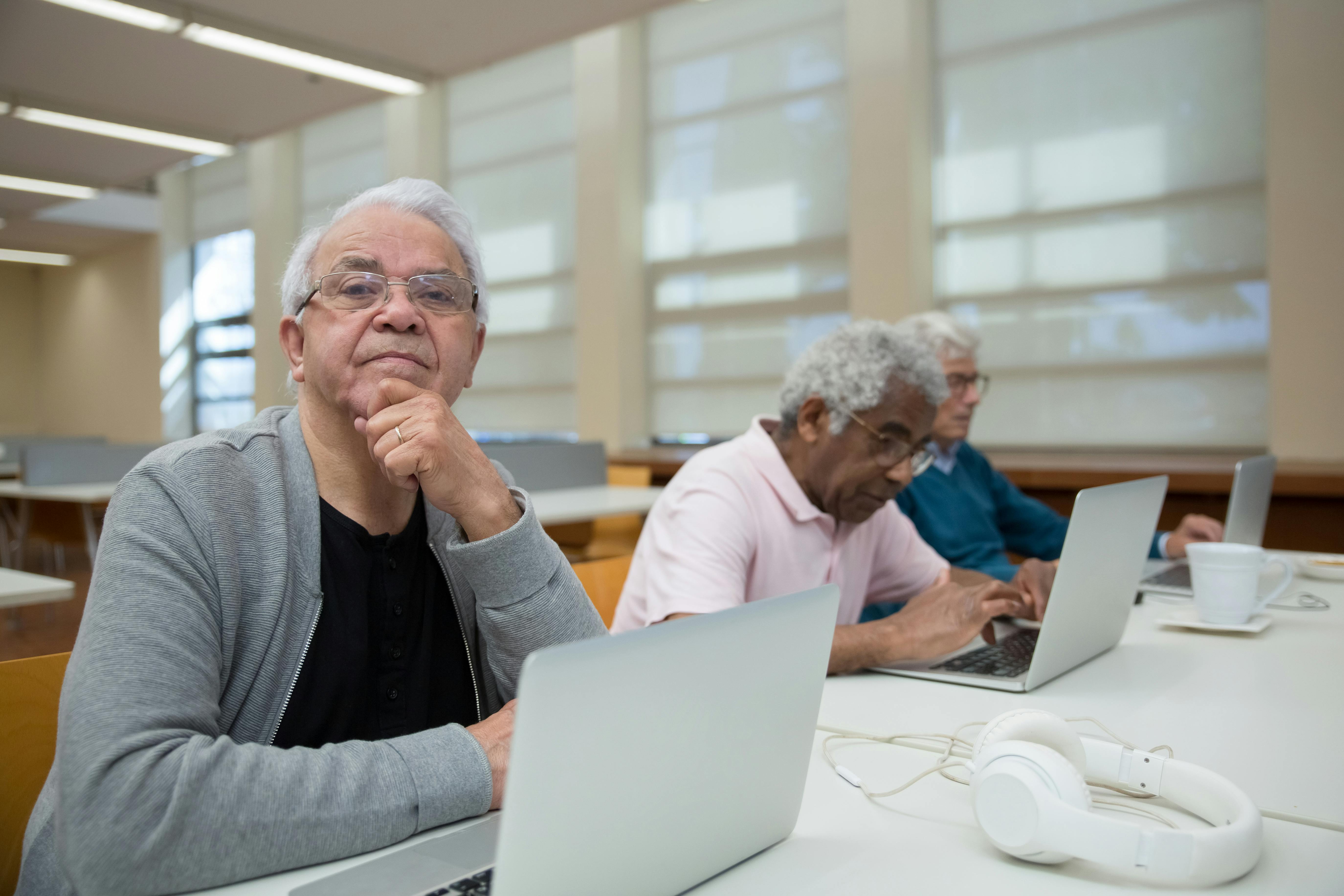 Elderly People using Laptop · Free Stock Photo