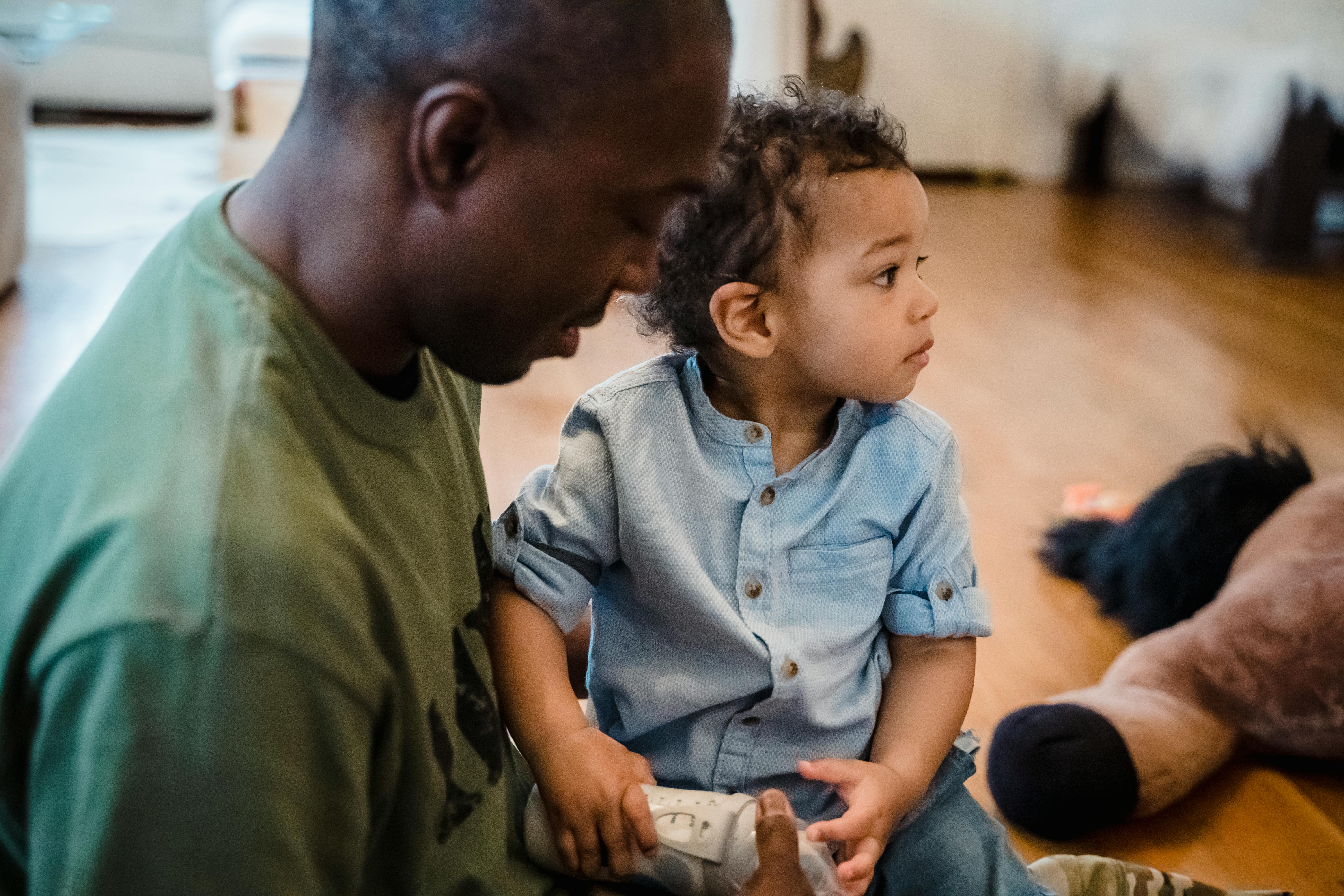 A Father Caring for His Son · Free Stock Photo