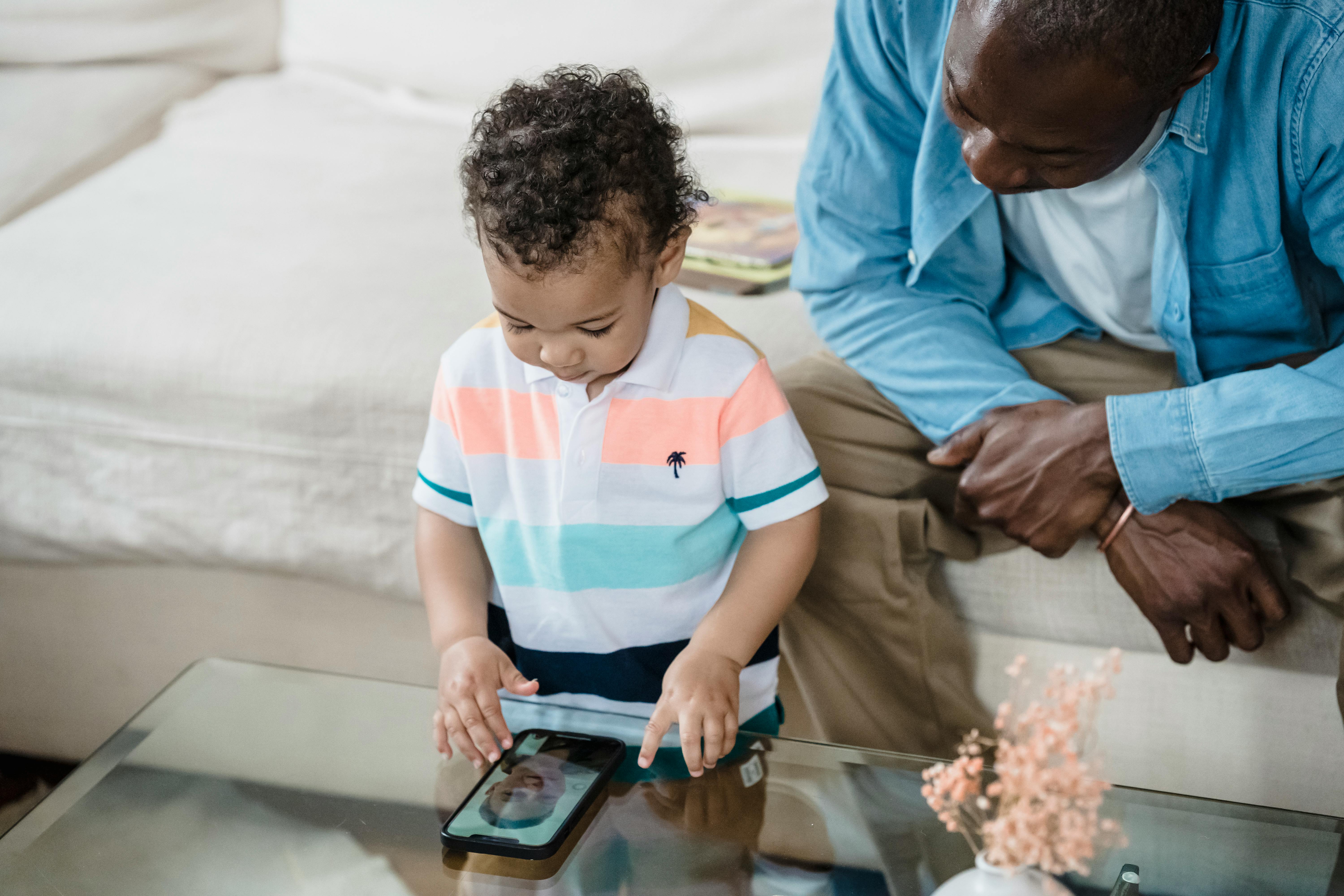 Man and Kid Talking on Video Call · Free Stock Photo