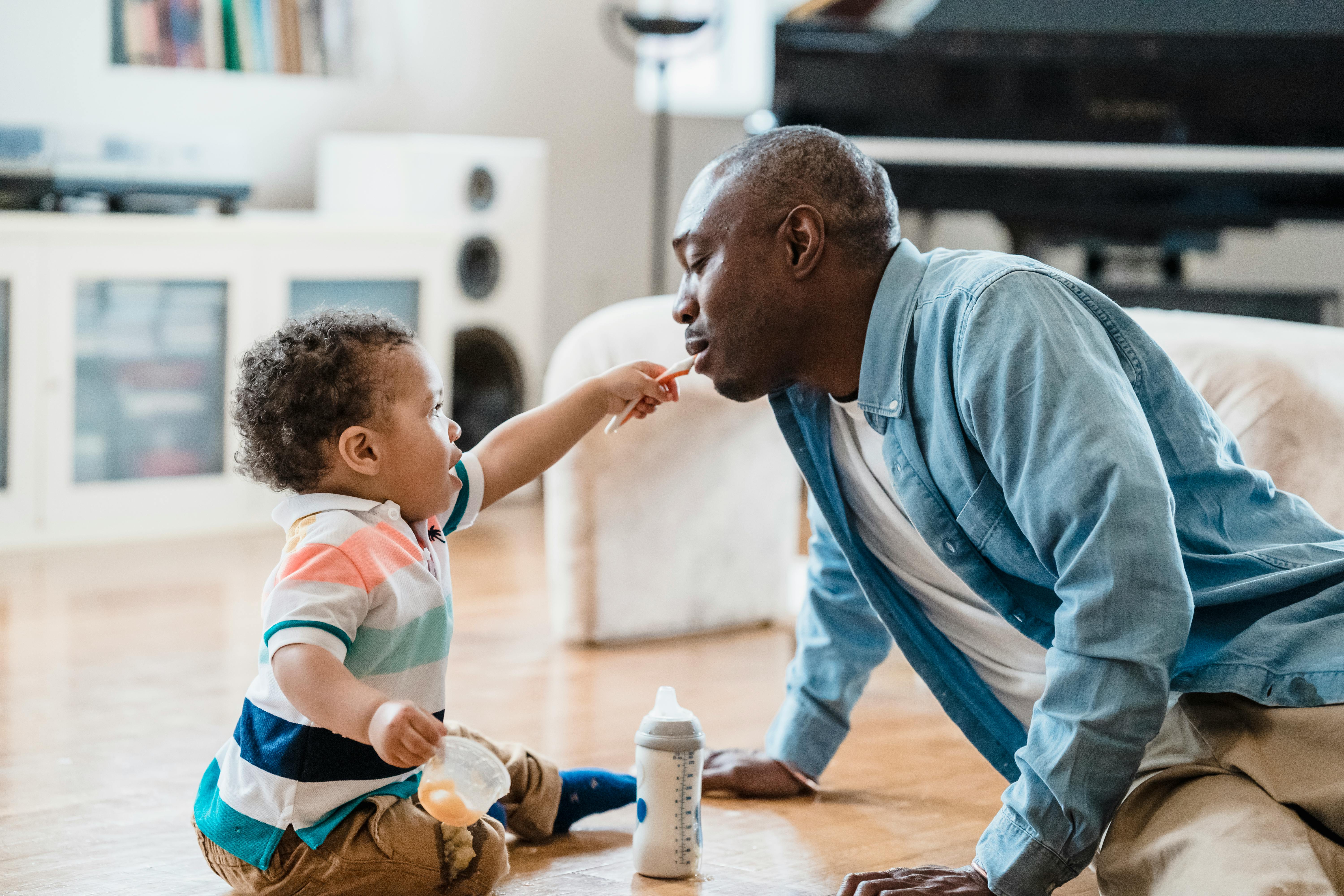 A Father Sitting with his Son · Free Stock Photo