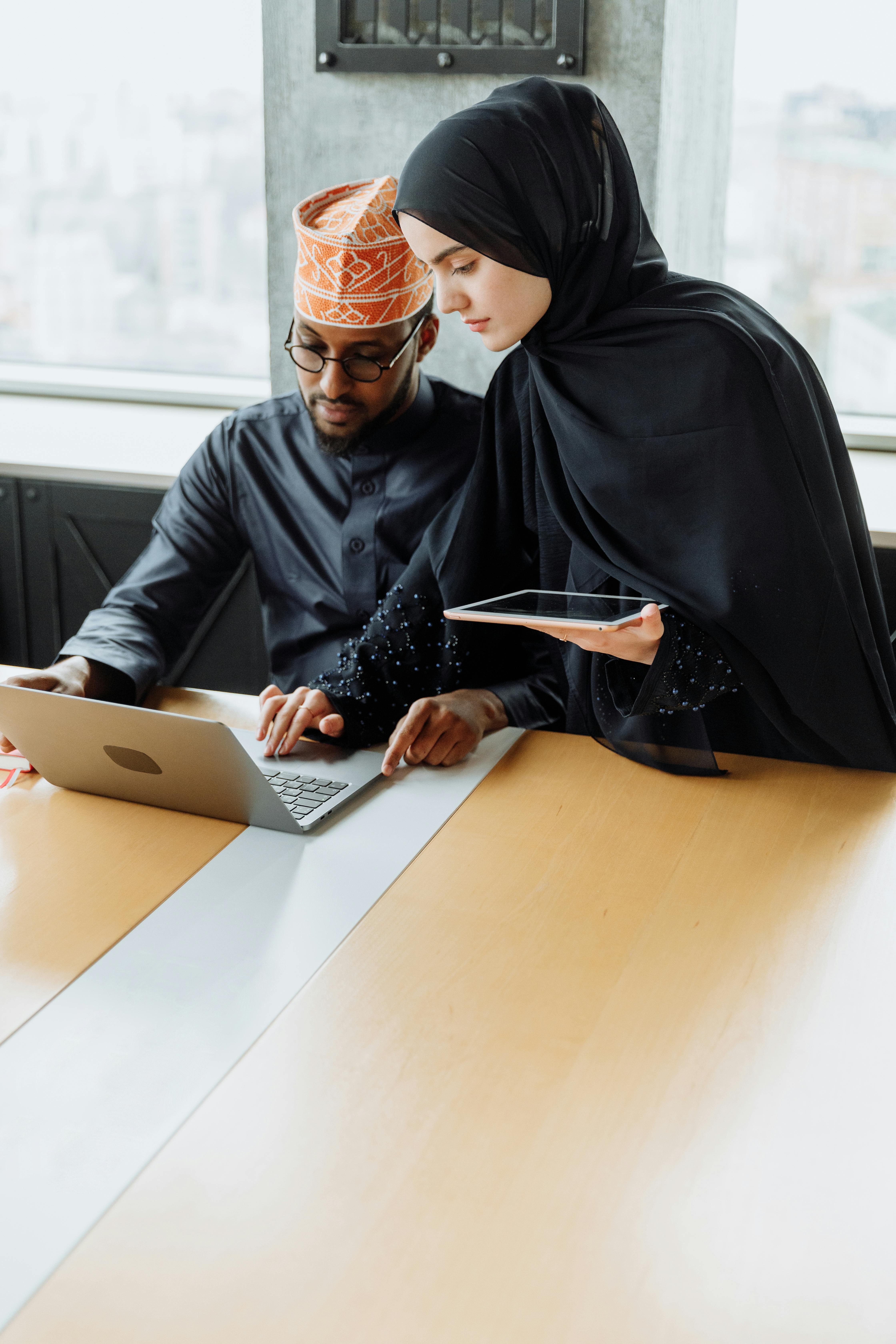Man and Woman Using Laptop · Free Stock Photo