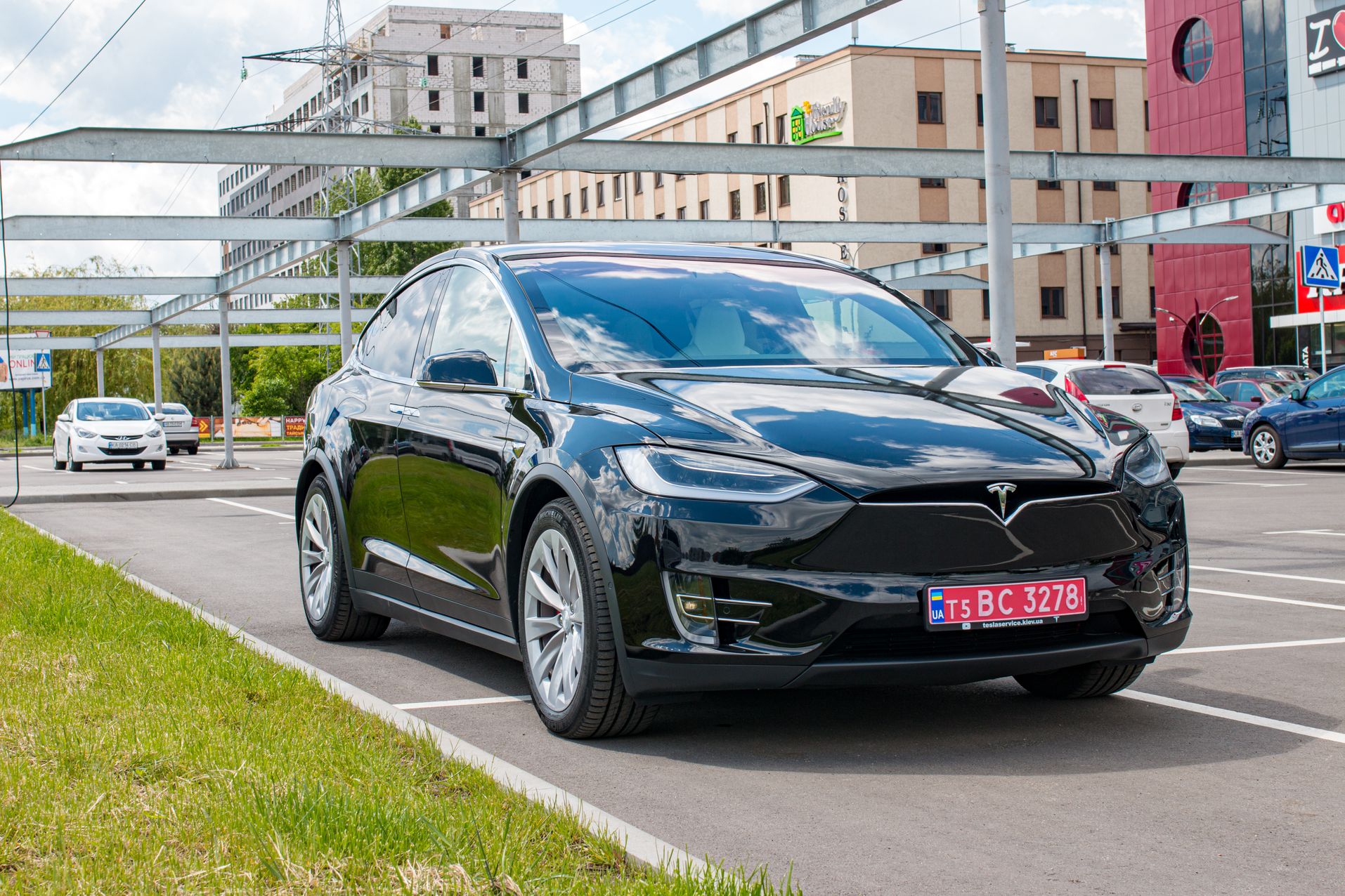 is tesla an american company or a global player?