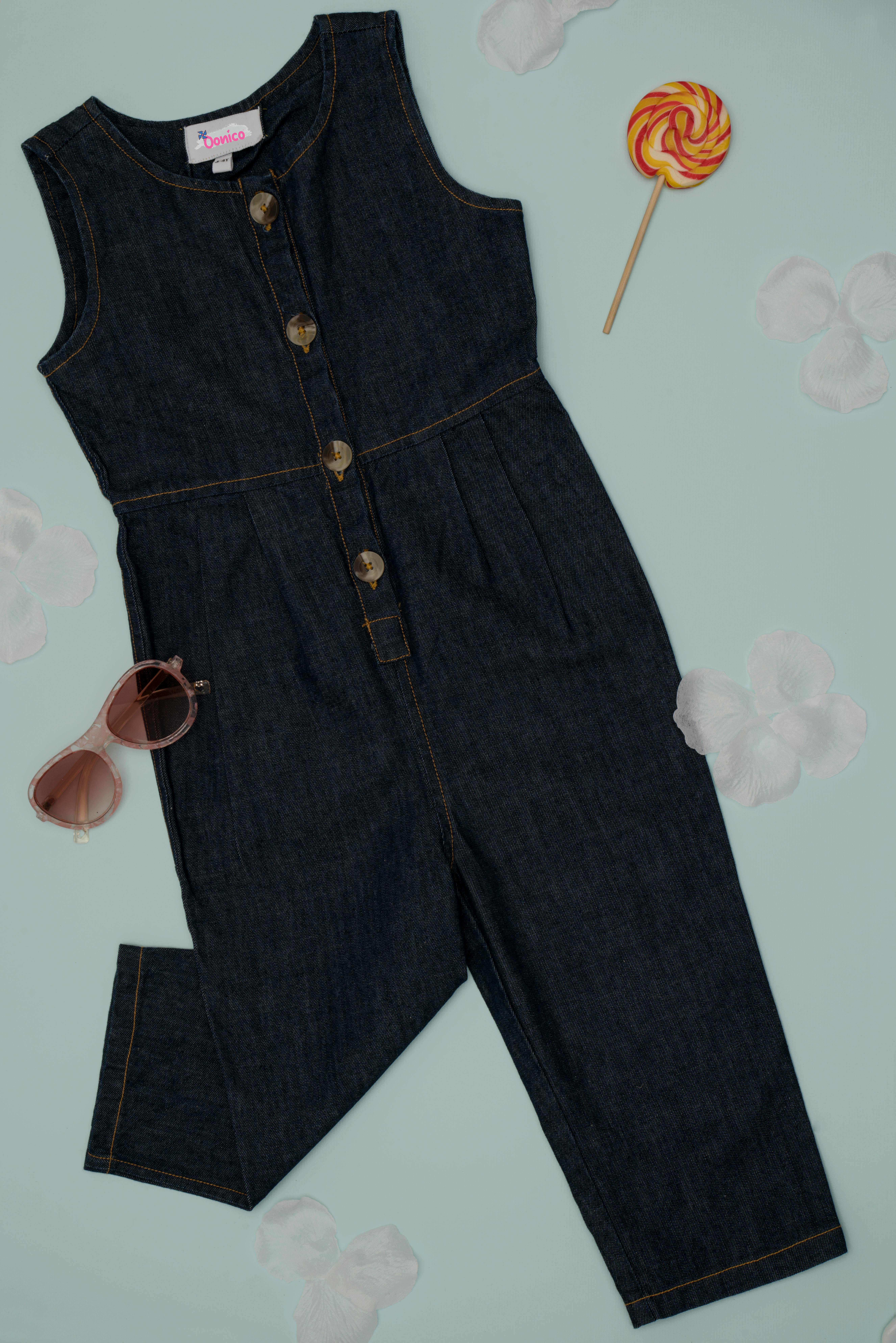 A Girls Denim Jumpsuit and Sunglasses · Free Stock Photo