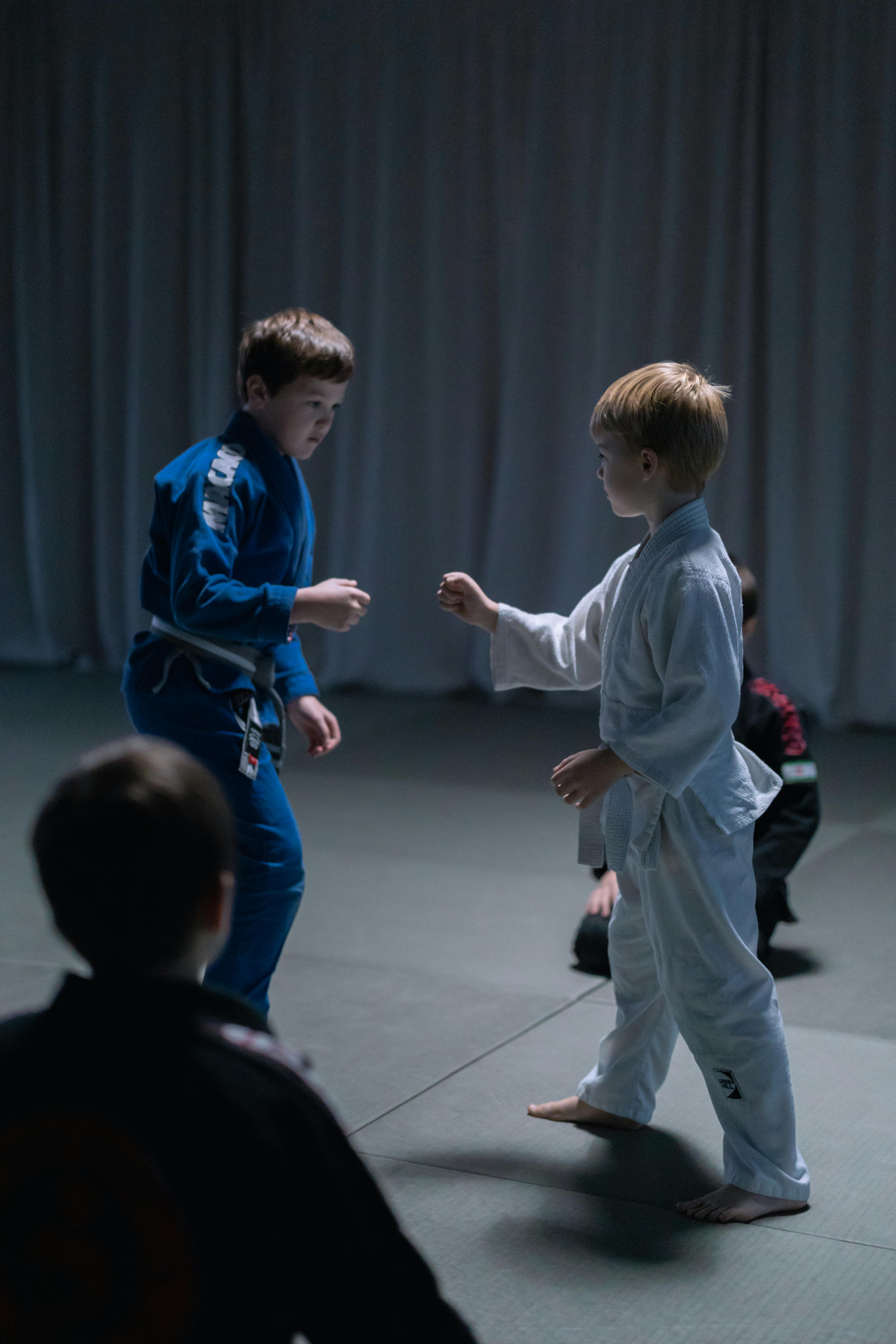 Boys Sparring on Black Mat · Free Stock Photo