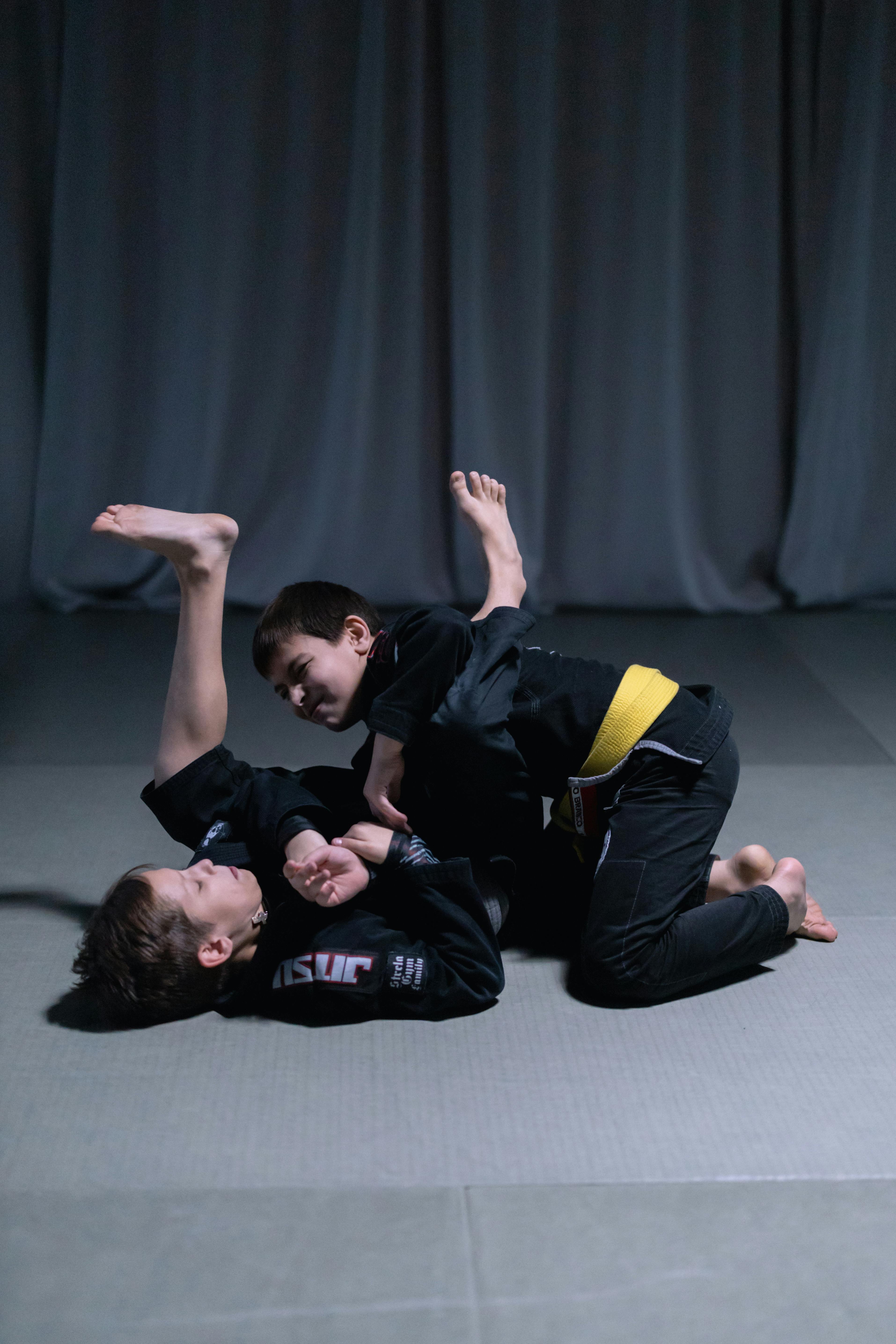 Boys Sparring on Black Mat · Free Stock Photo