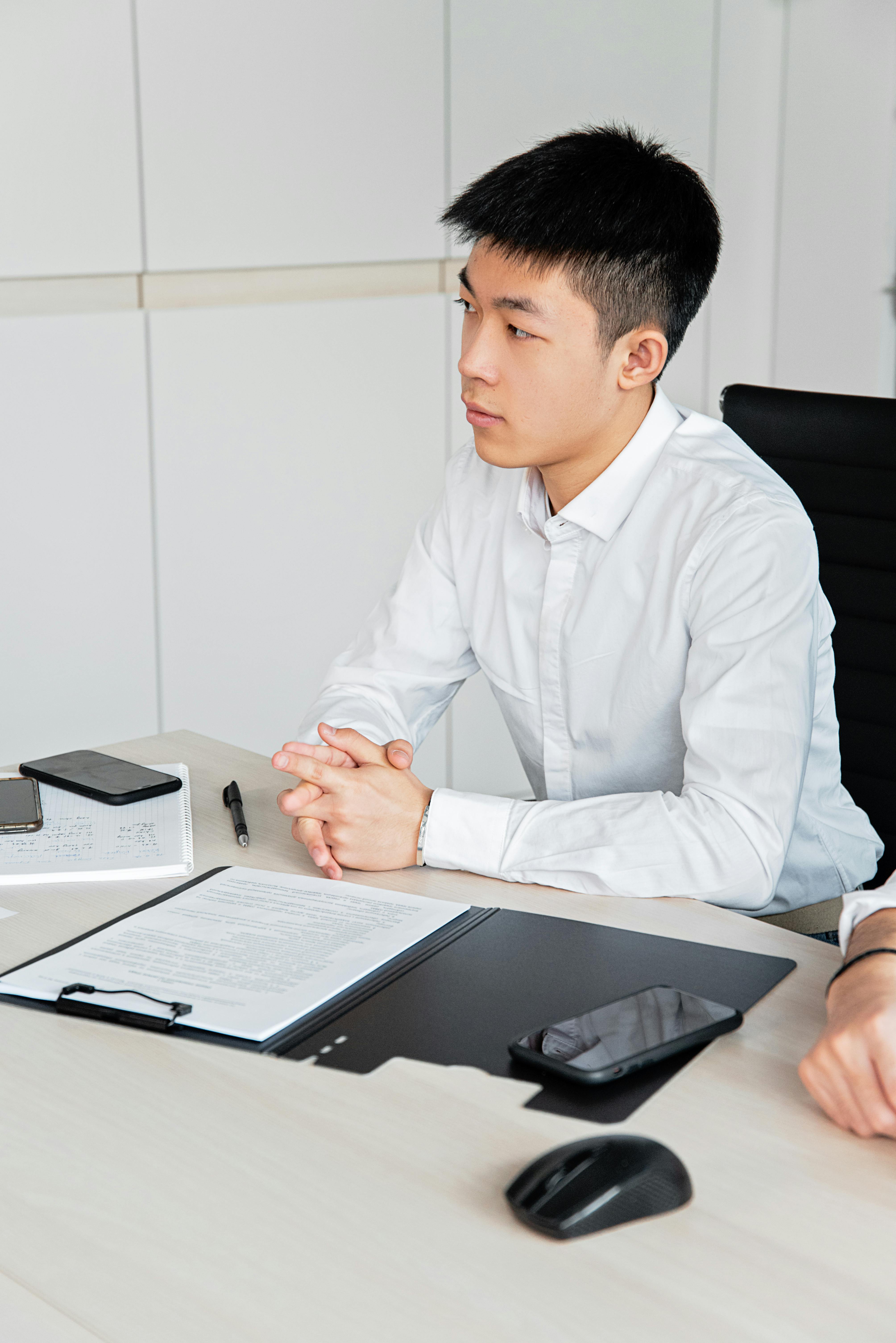 A Man Sitting in an Office · Free Stock Photo