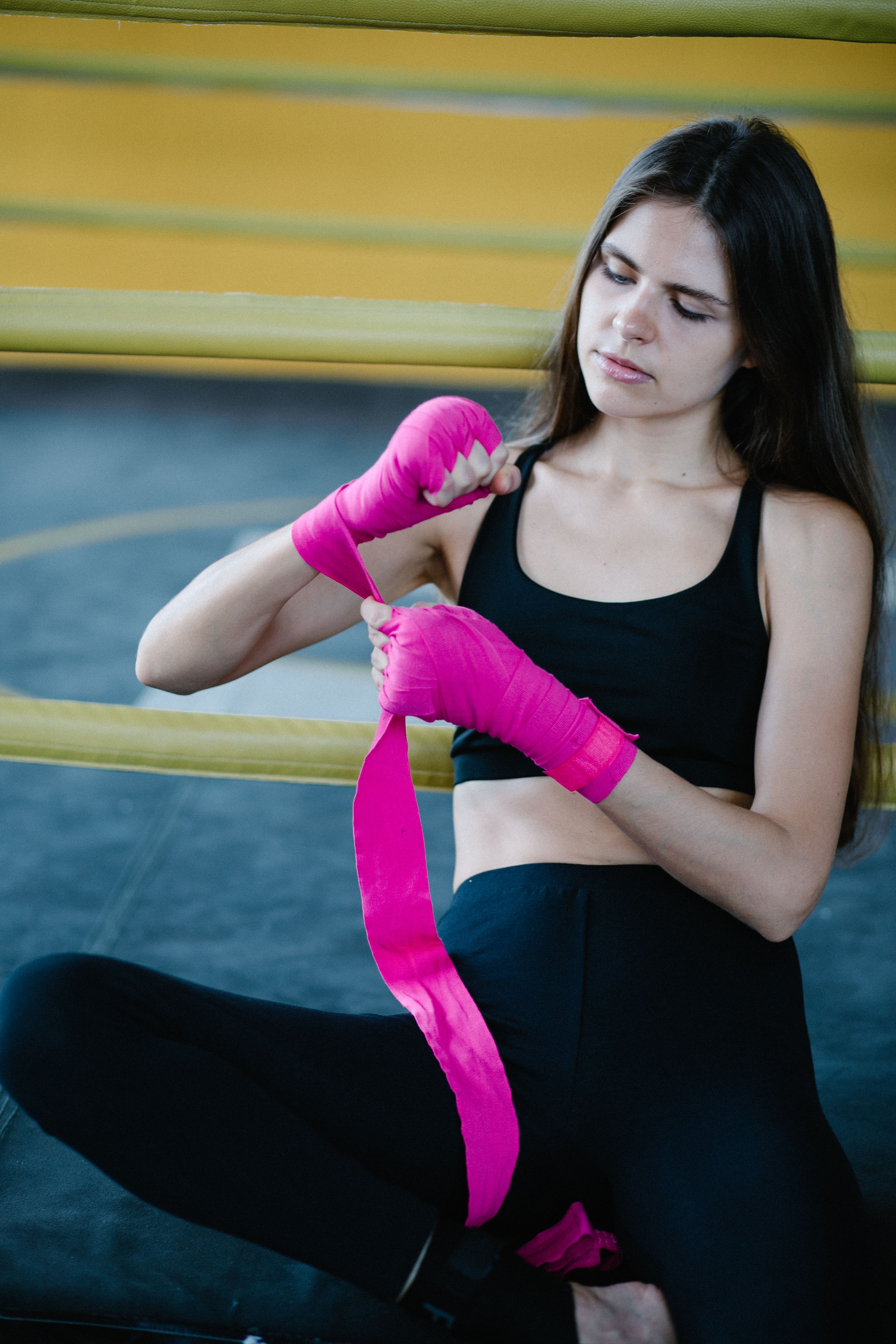 Female Boxer Wrapping her Hands · Free Stock Photo