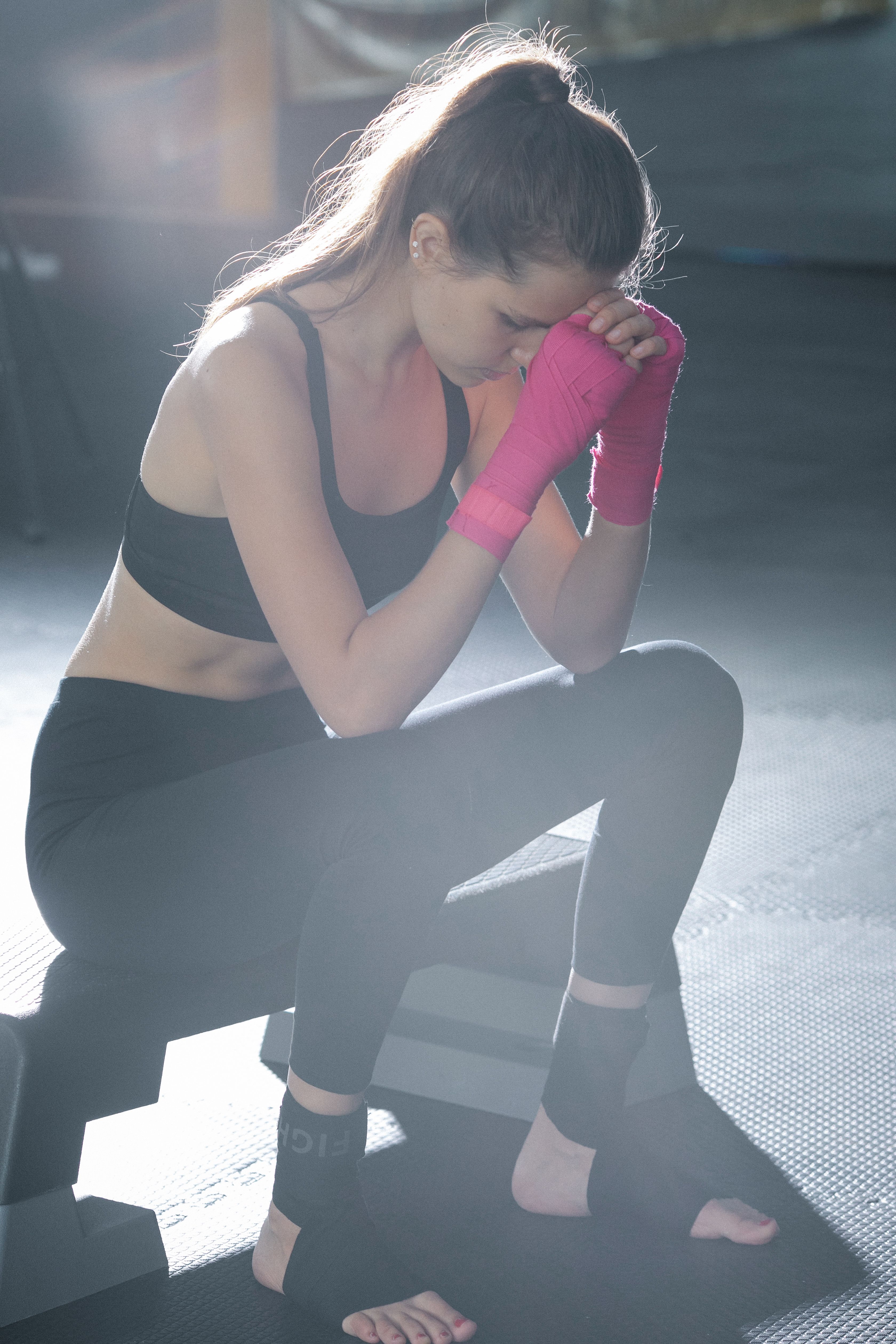 Woman Sitting in Boxing Clothes · Free Stock Photo