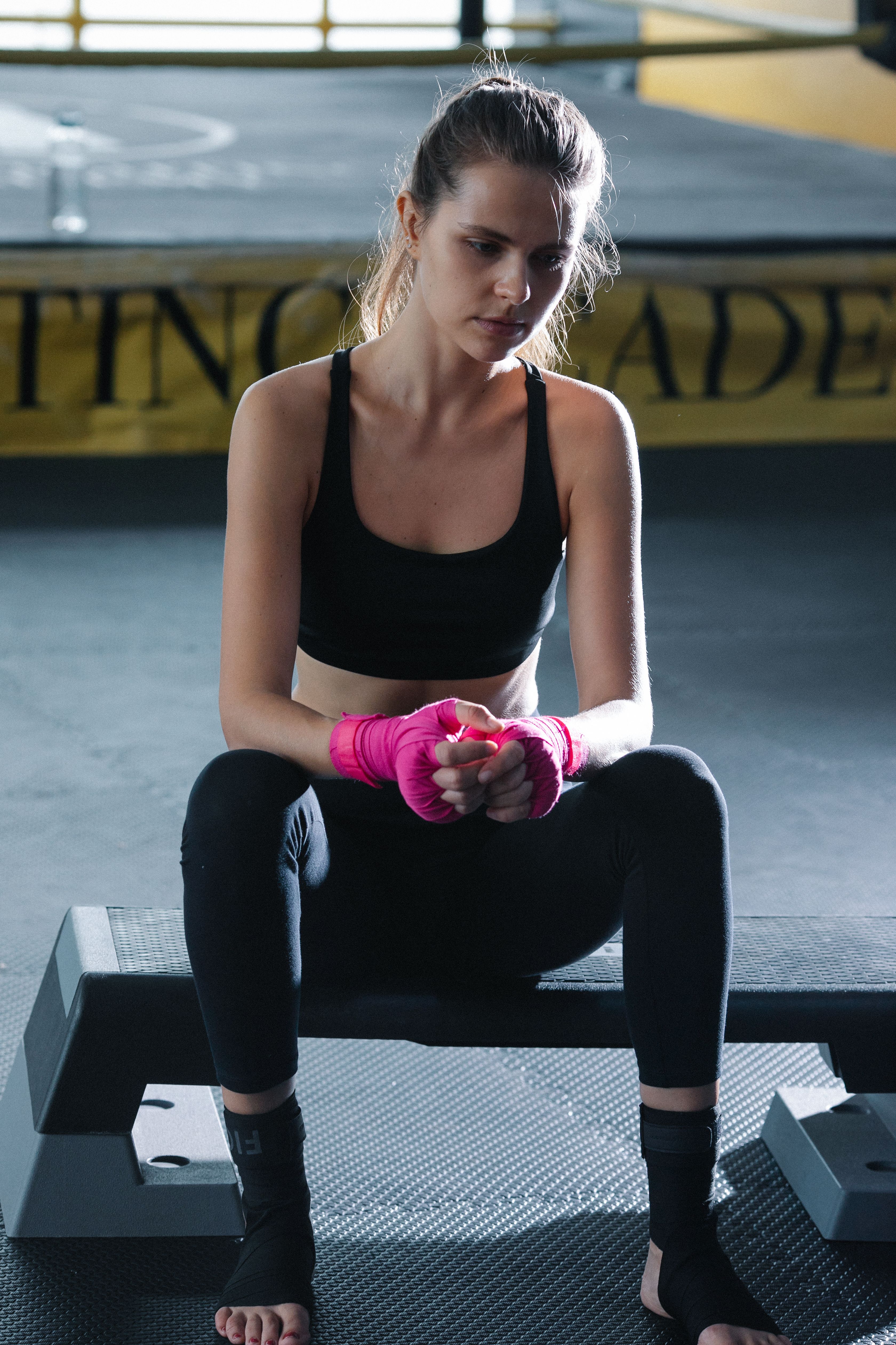 Woman Sitting in Boxing Clothes · Free Stock Photo