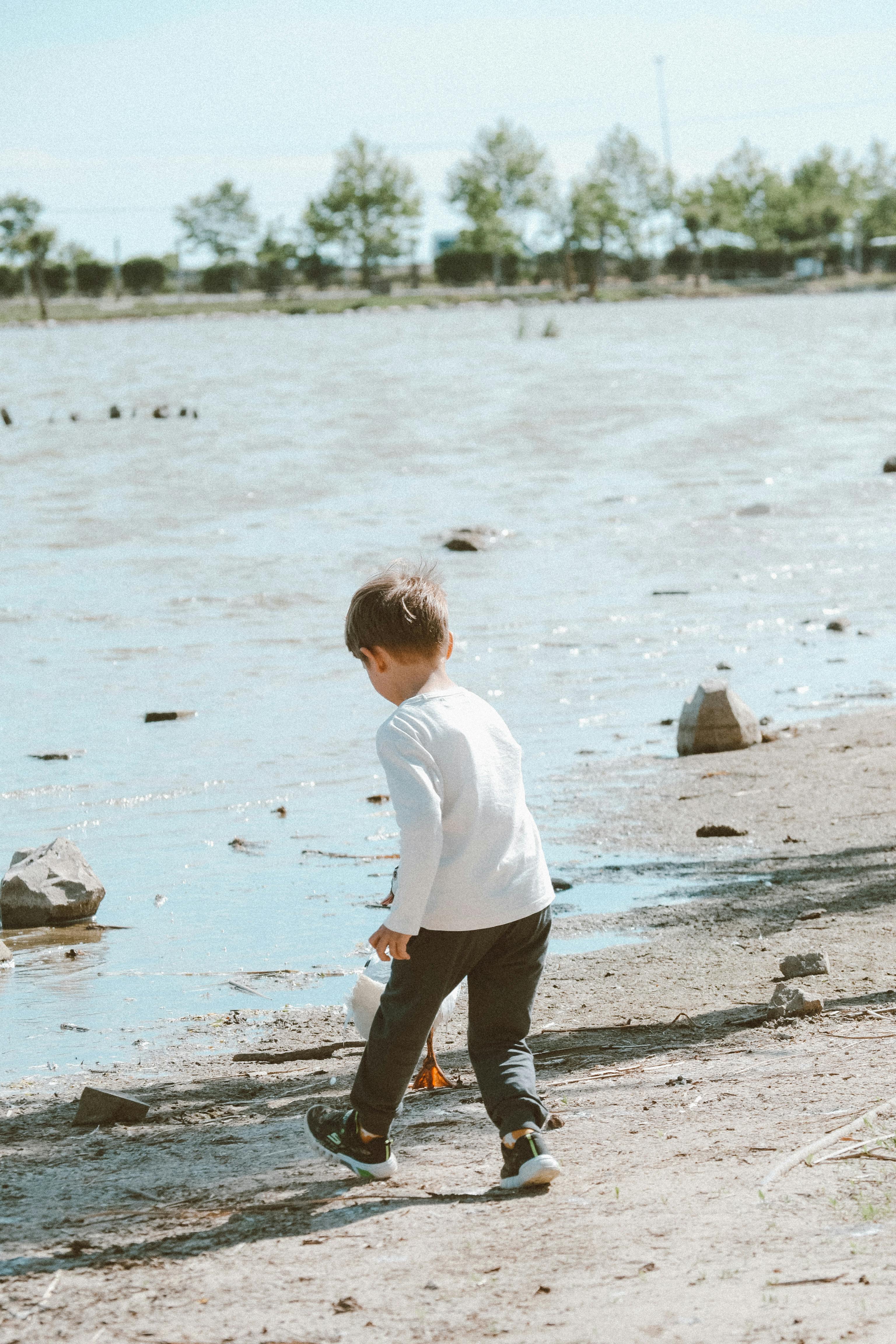 Boy Plating on the Sand · Free Stock Photo