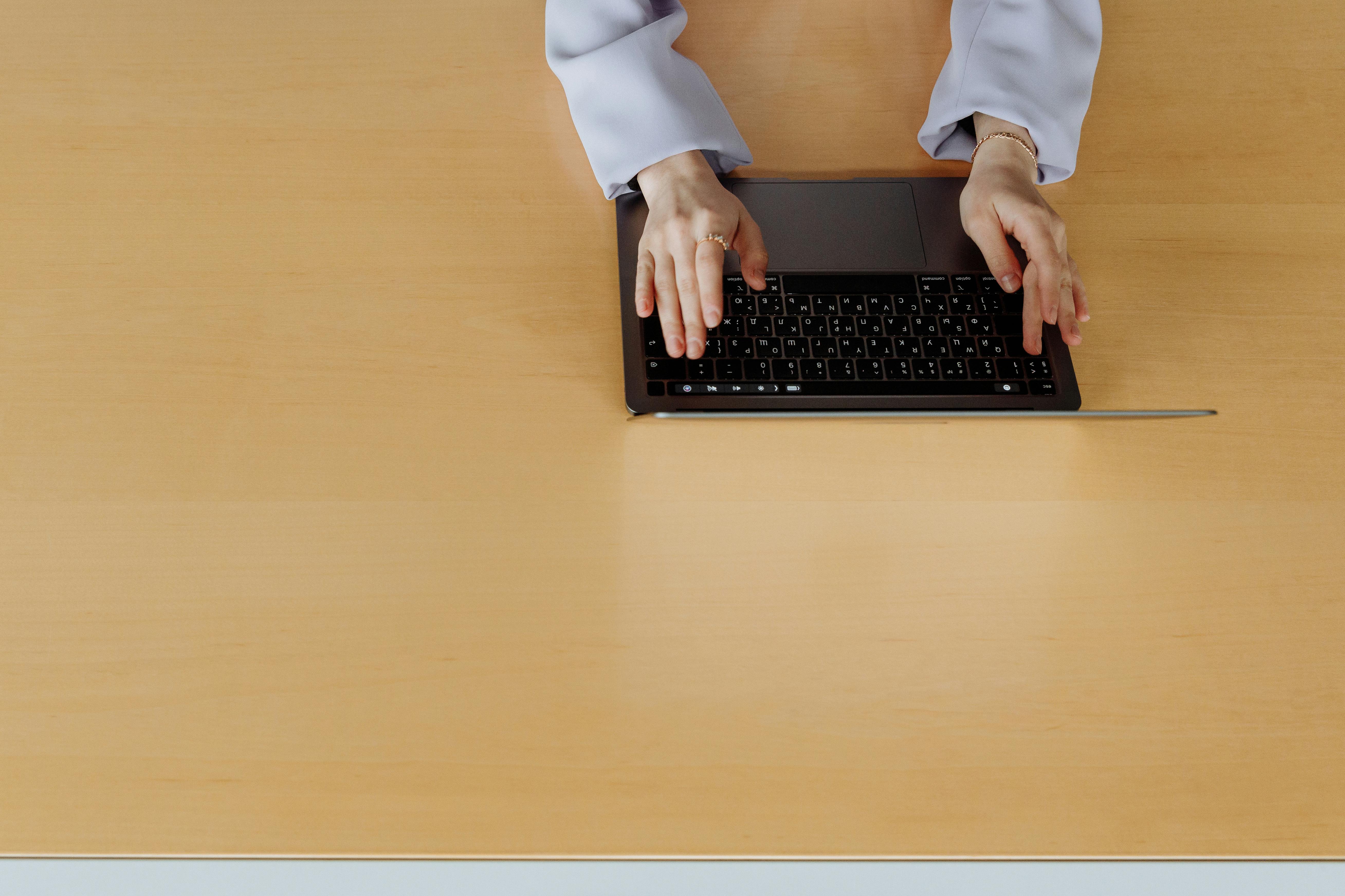 A Person Typing on Laptop · Free Stock Photo