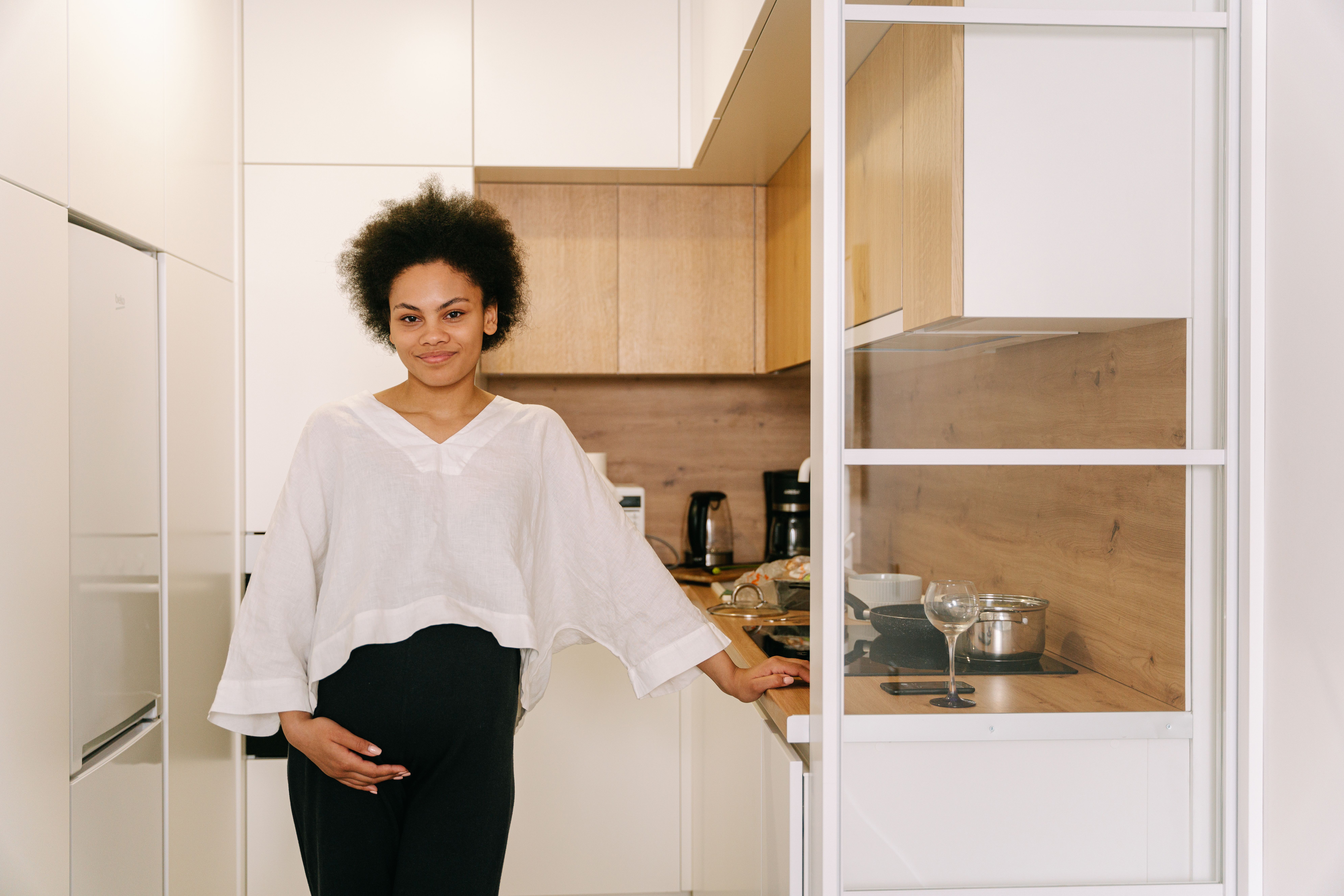 Black Woman Looking In Kitchen Cabinets Photos, Download The BEST Free ...