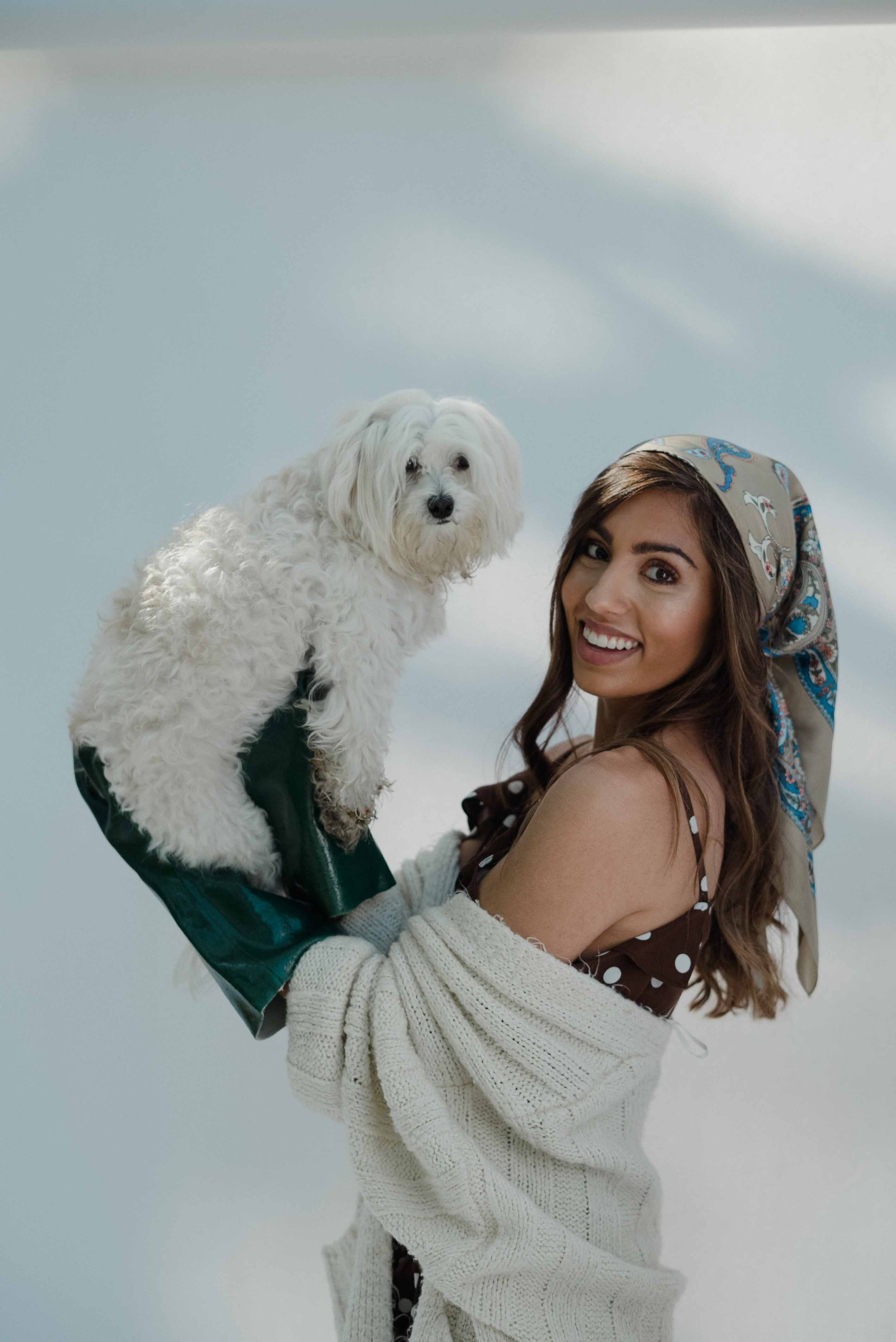 A Beautiful Woman Posing with a Dog · Free Stock Photo