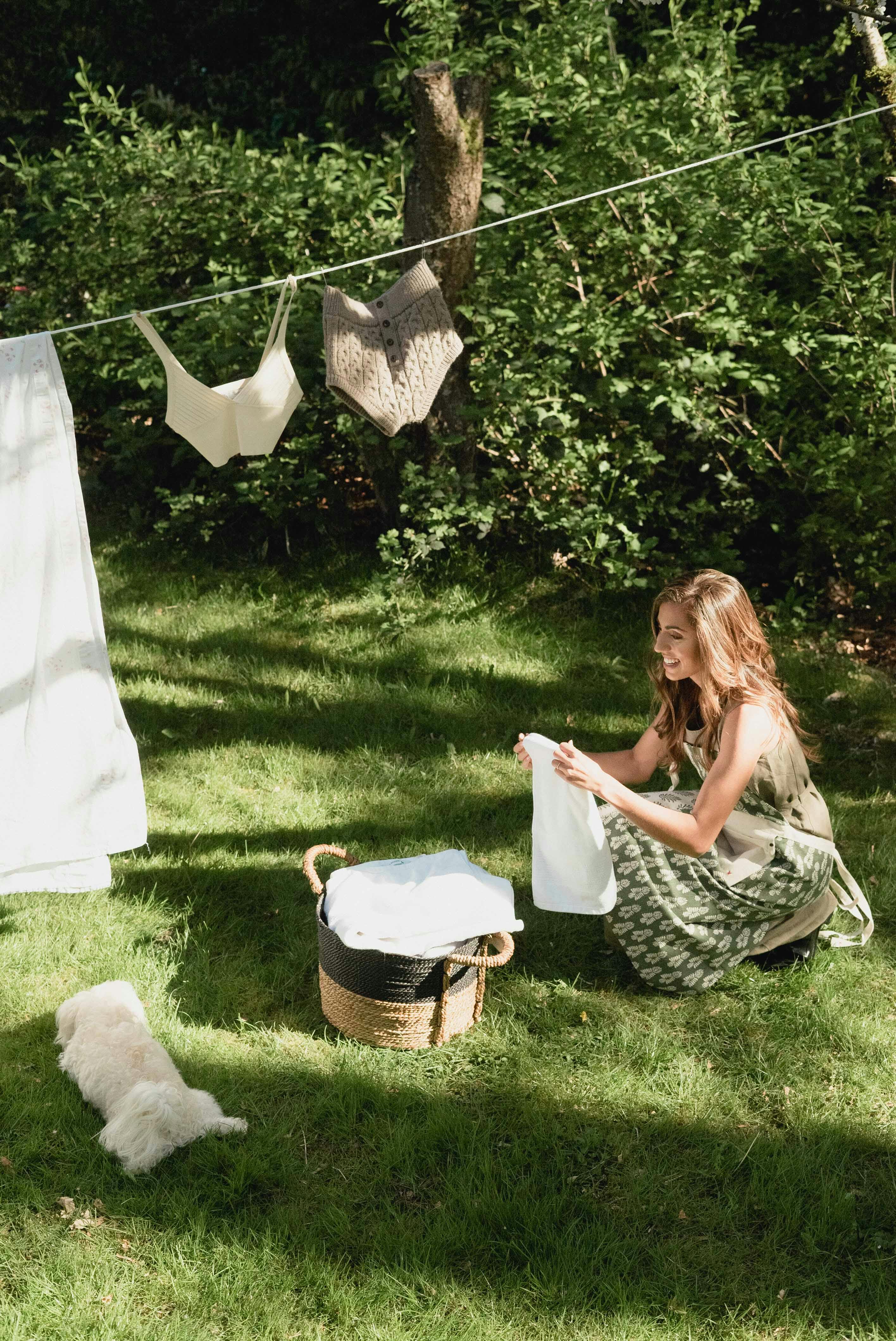 Woman Hanging Laundry · Free Stock Photo