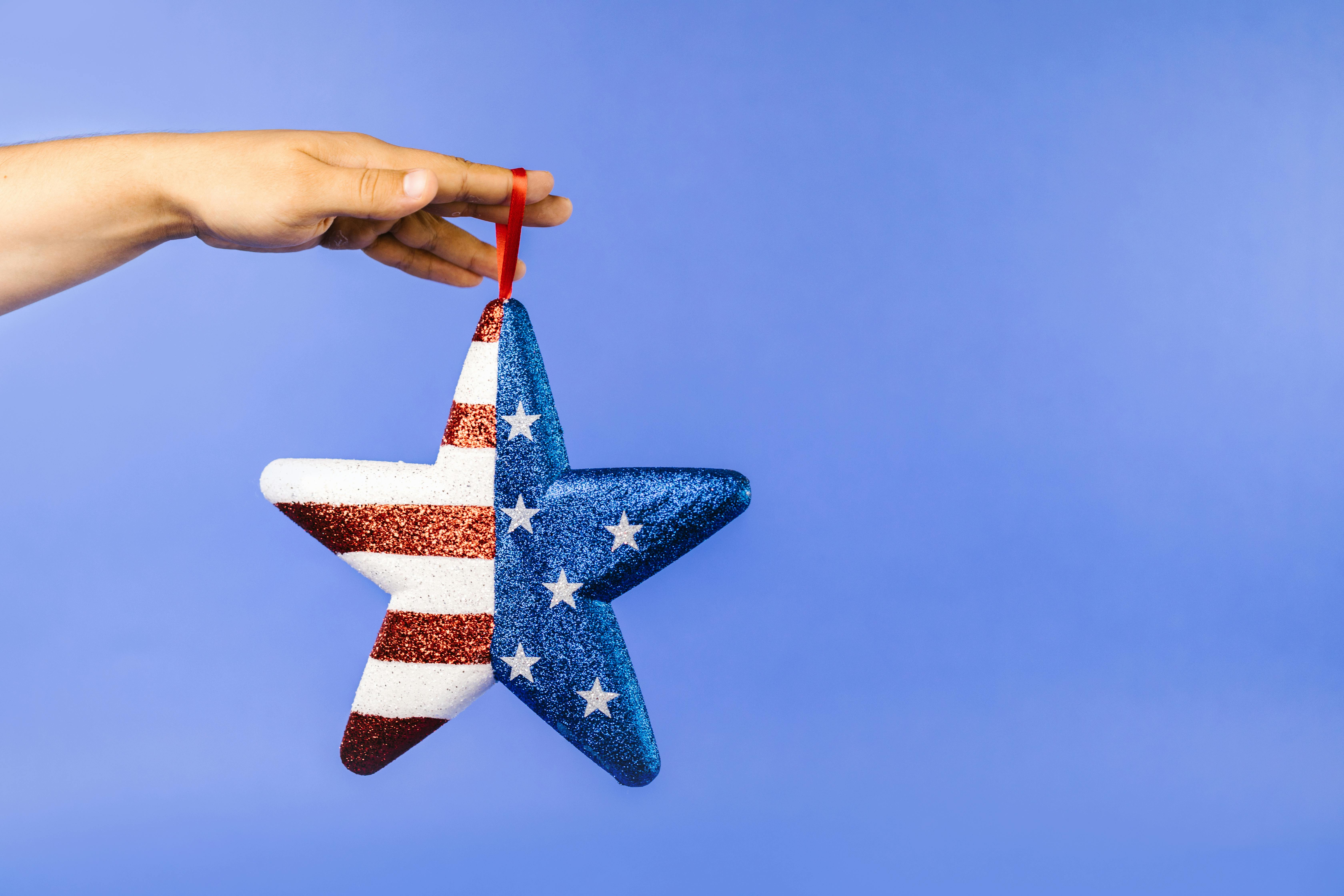 A Miniature Star on a Stick with Stars and Stripes · Free Stock Photo