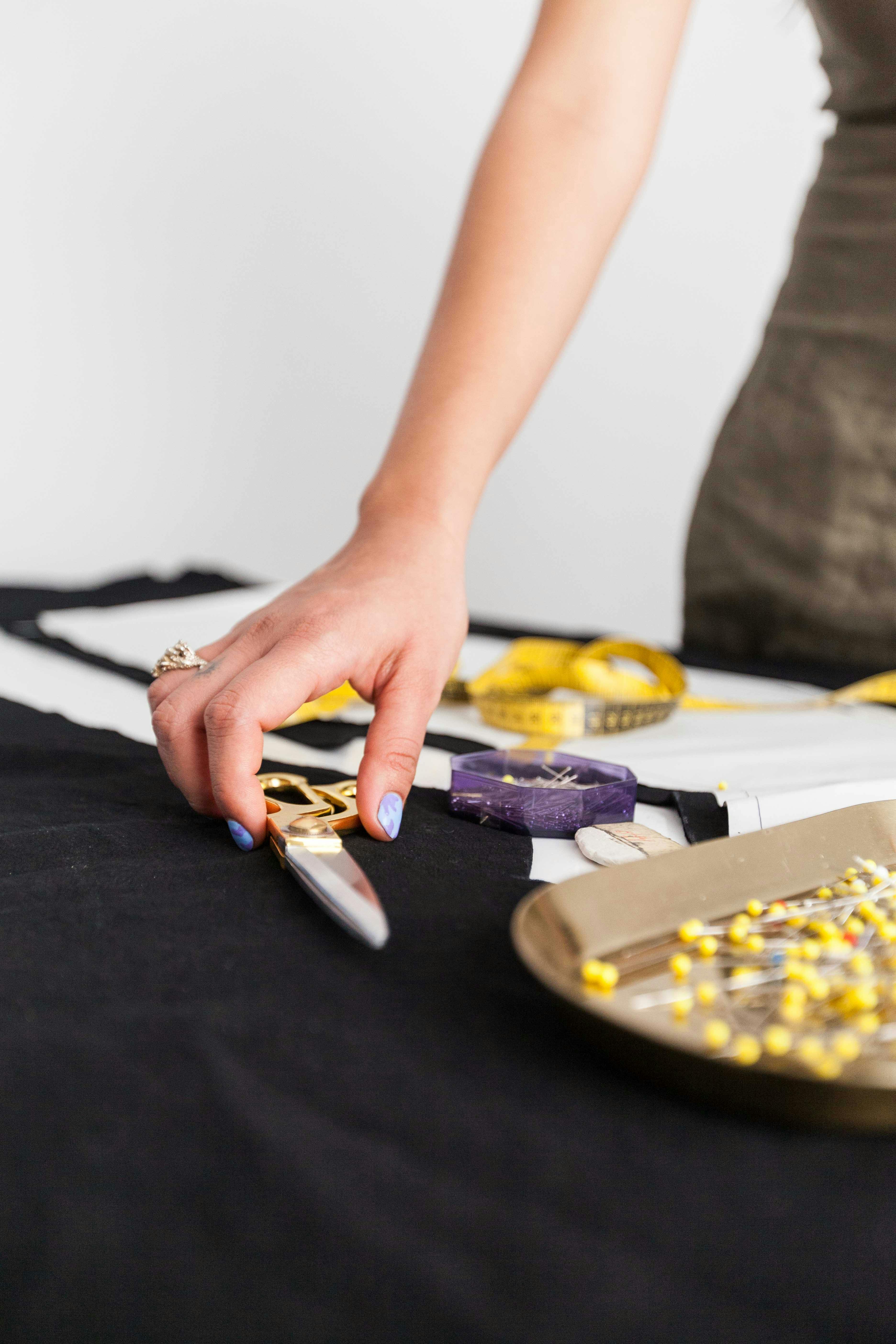 A Person Holding a Scissor · Free Stock Photo