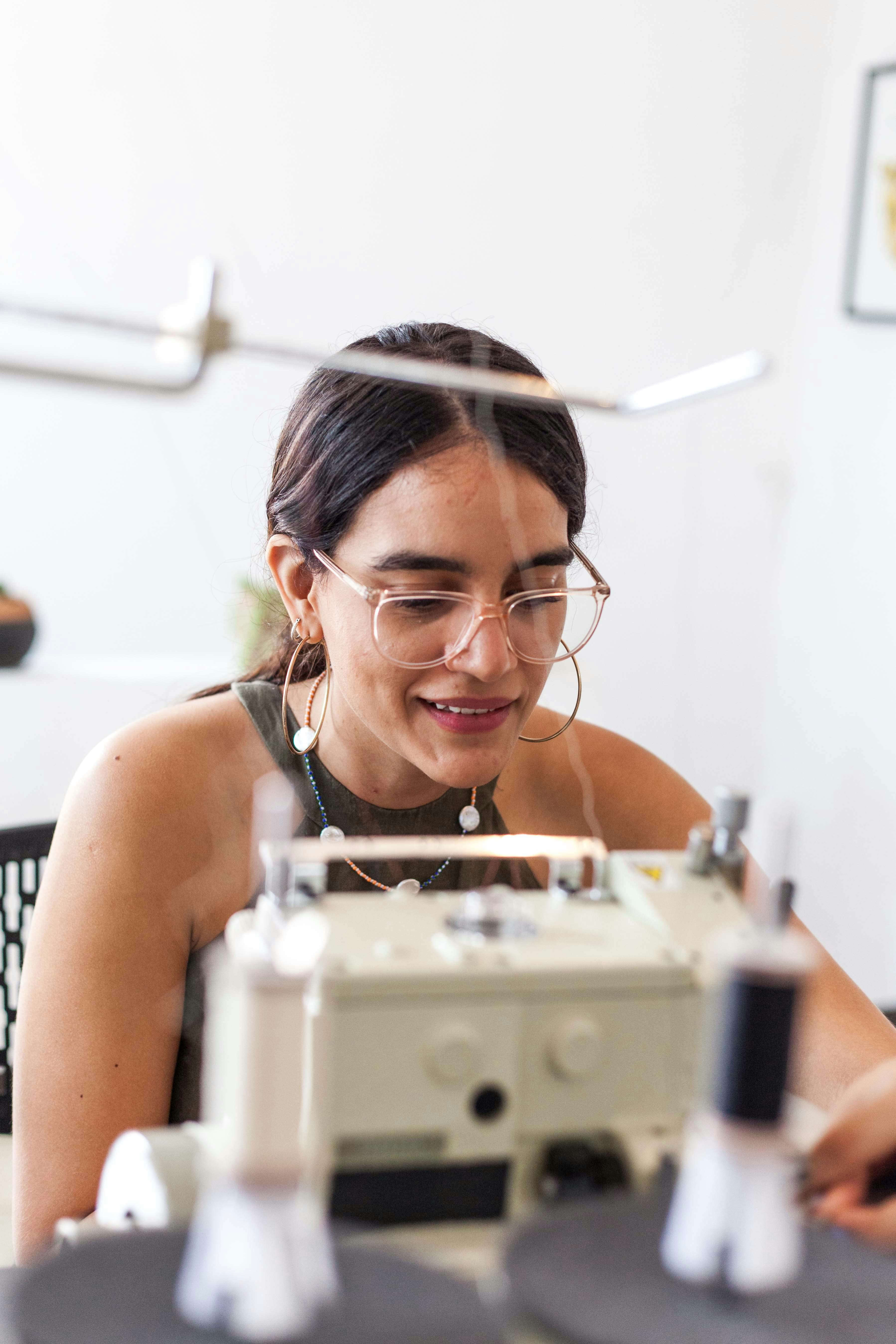 A Woman using a Sewing Machine · Free Stock Photo