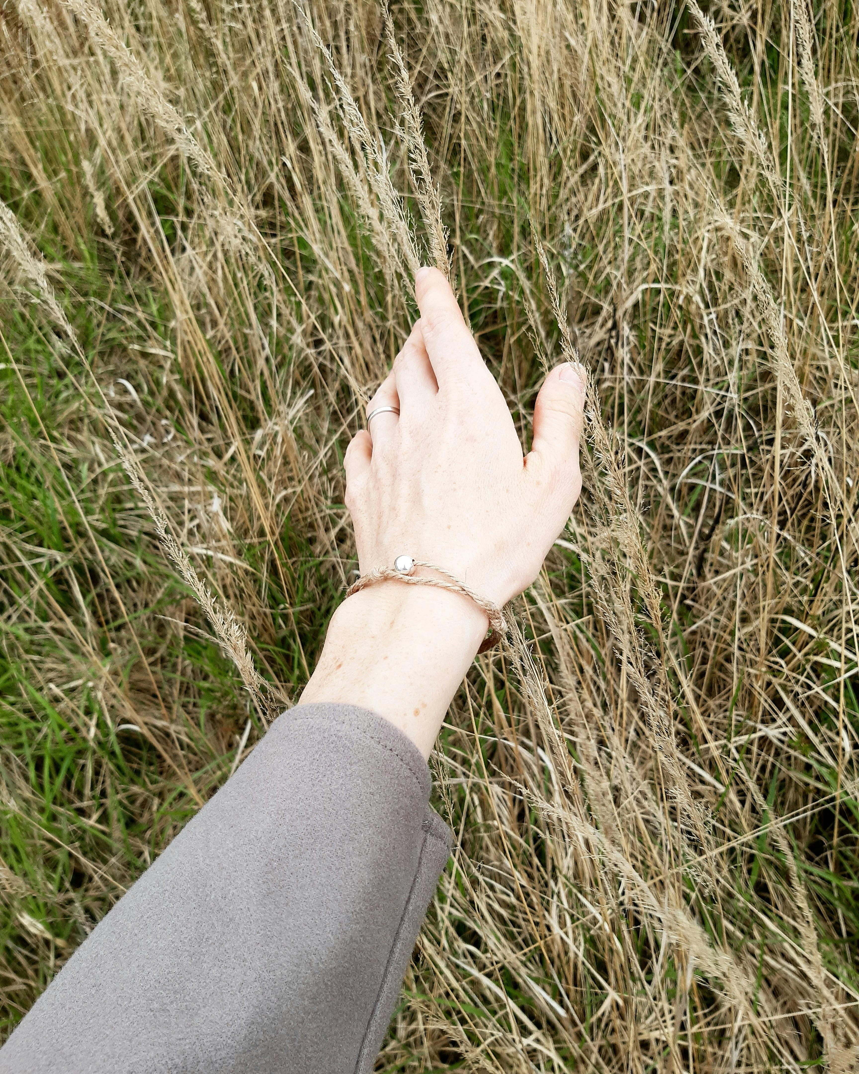 Two People Touching Each Other's Hands · Free Stock Photo