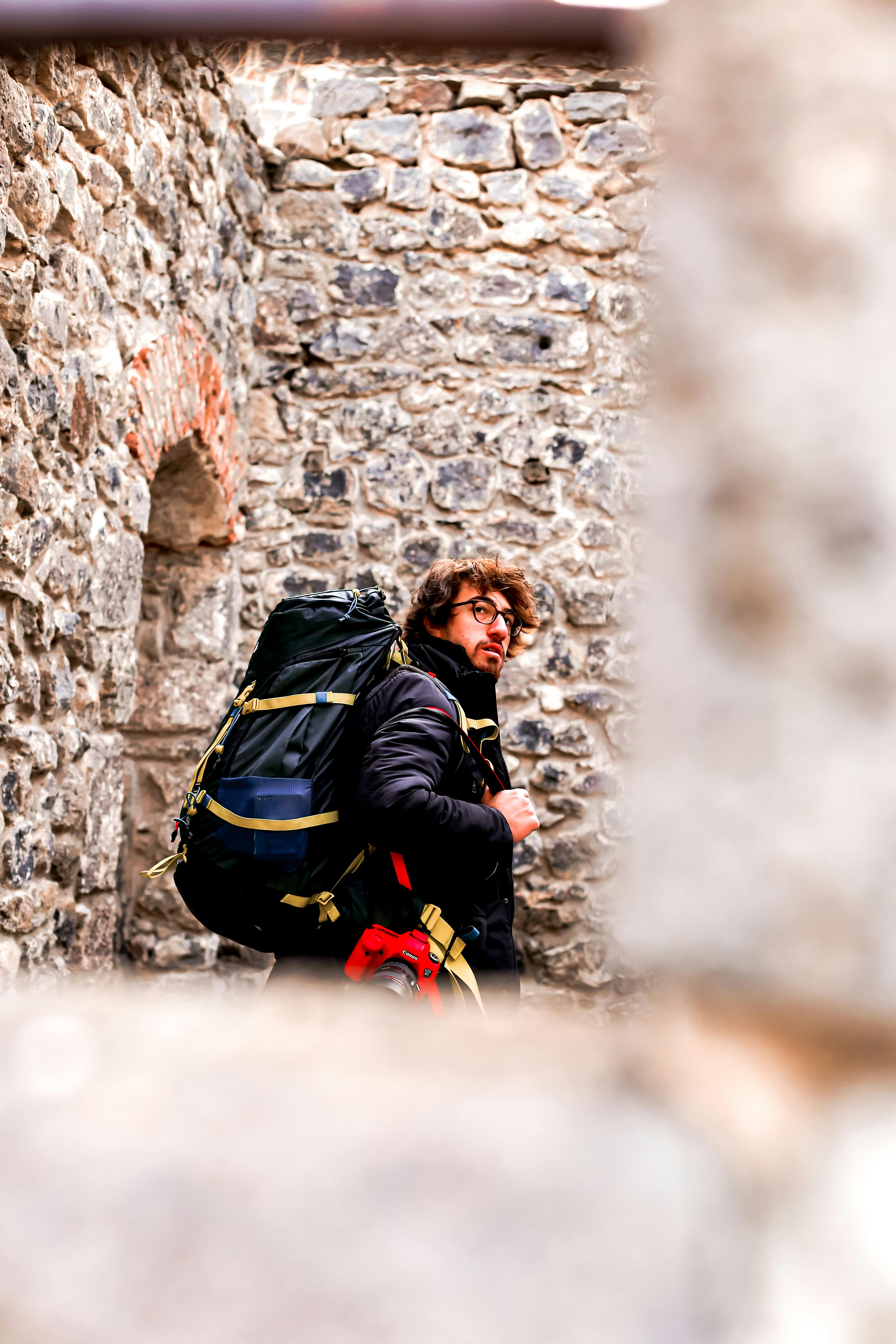 A Man Carrying a Backpack · Free Stock Photo