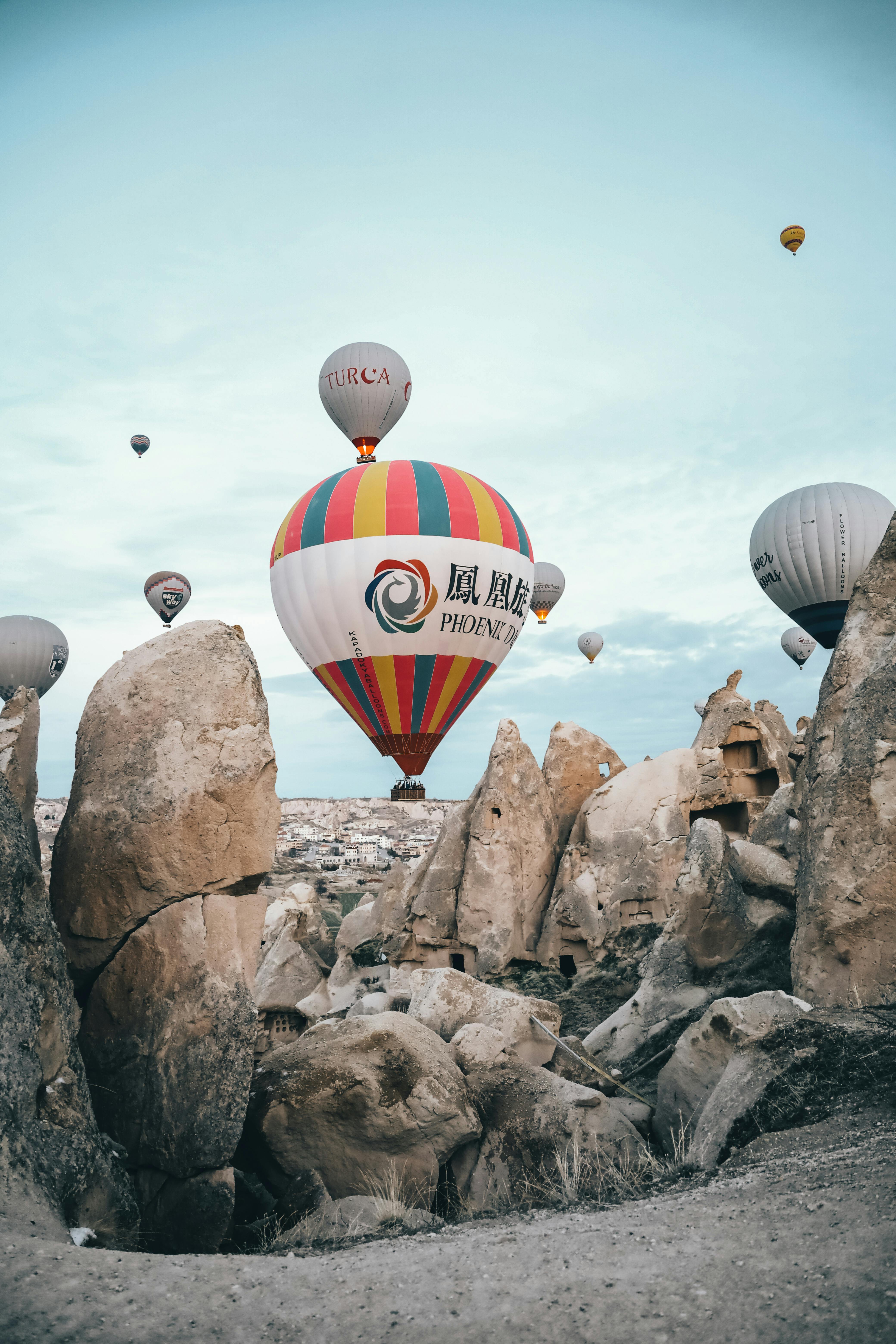 Hot Air Balloons Flying above Rock Formations in Cappadocia · Free ...