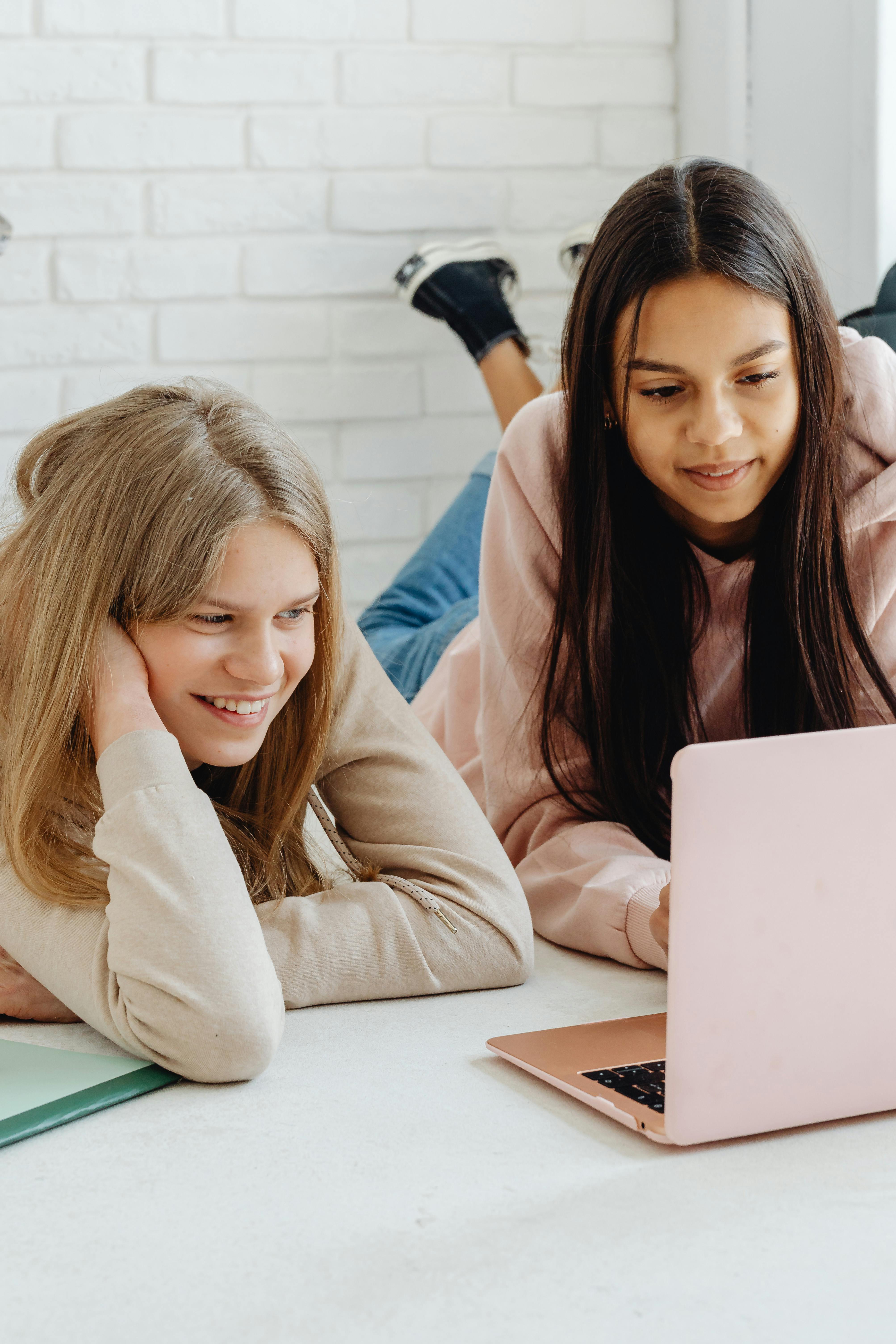 Young Girls using a Laptop · Free Stock Photo